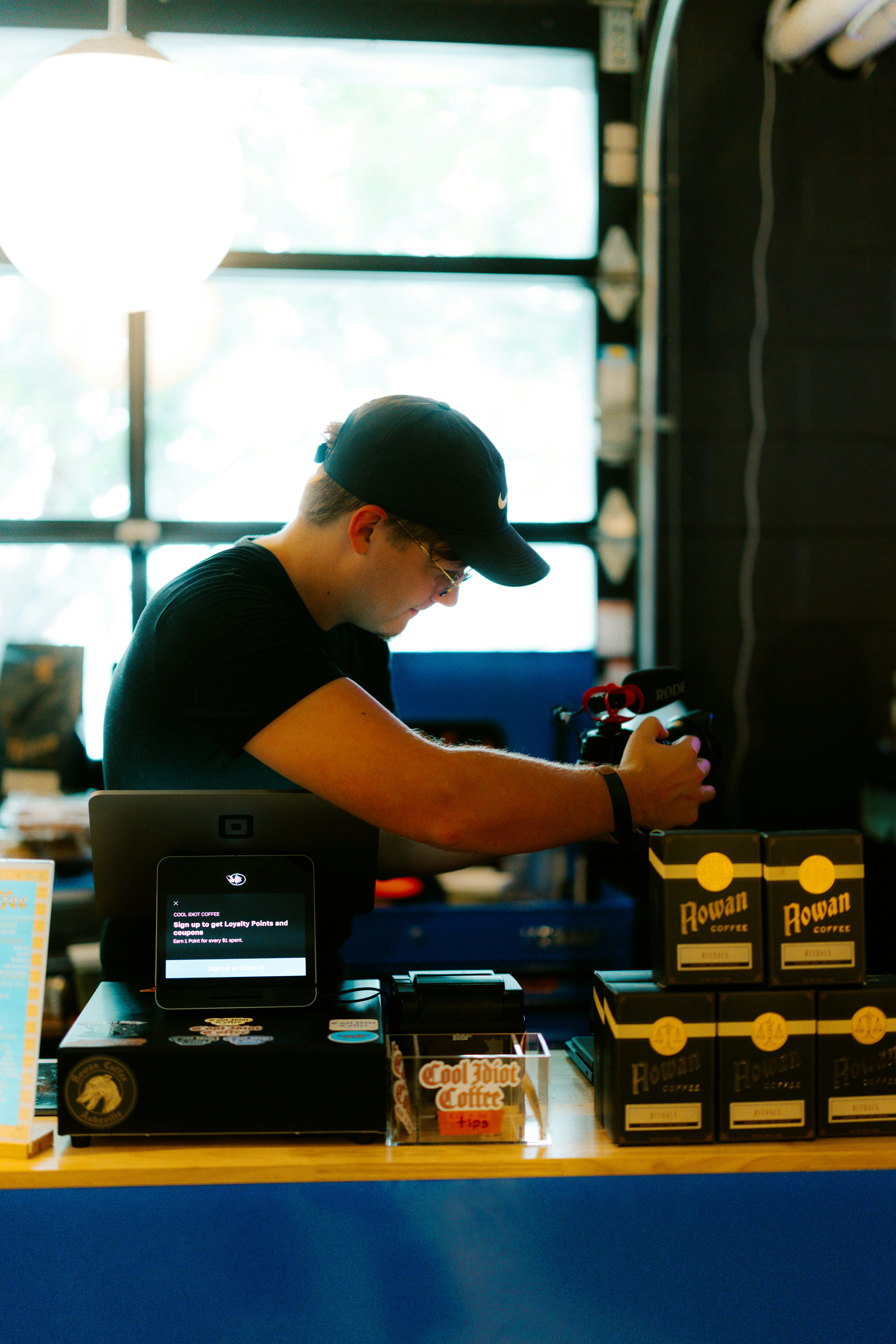 Barista preparing order behind a counter