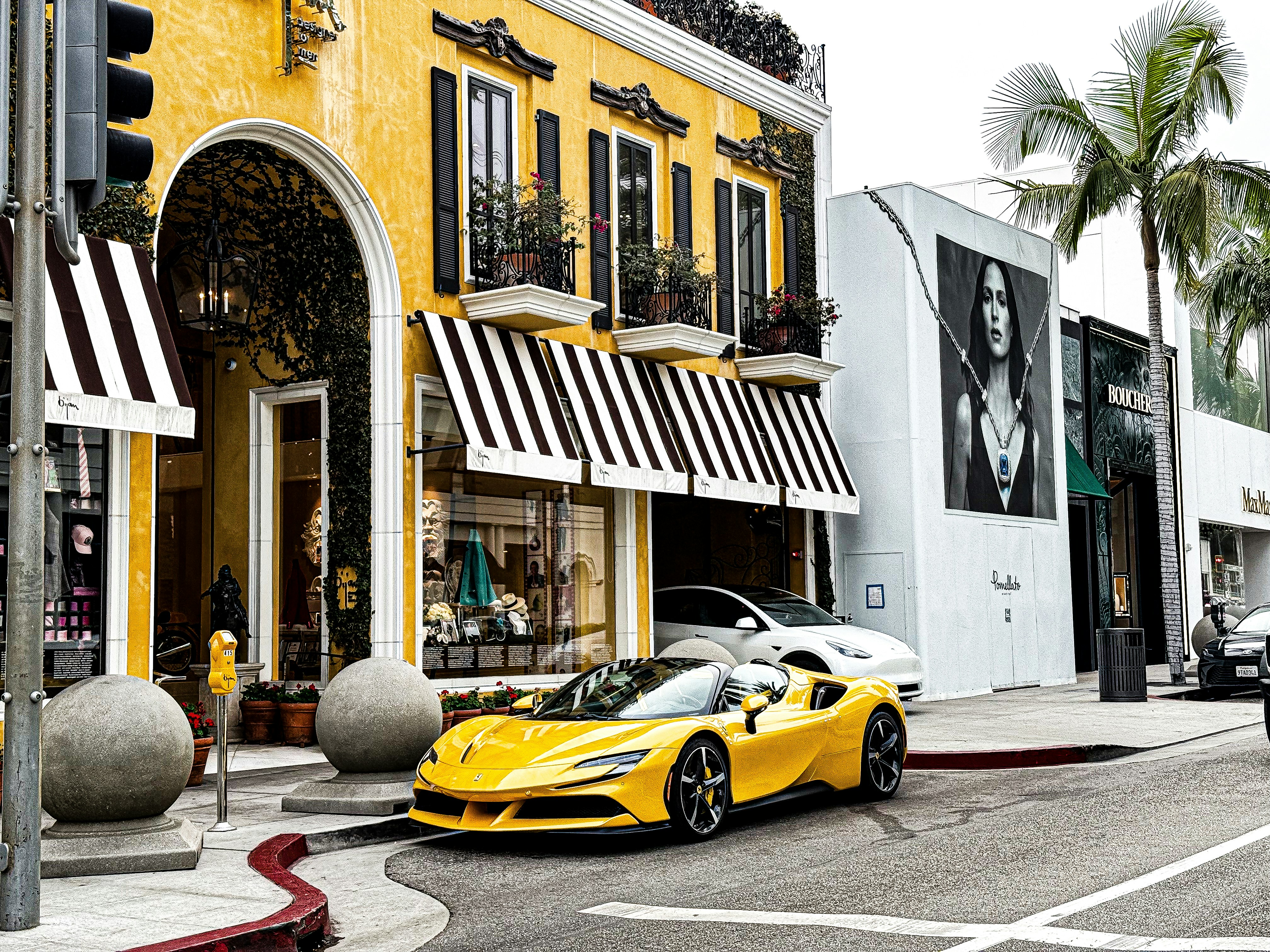 Ferrari SF90 Spider 🕷️ | Rodeo Drive, Bevery Hills, California | Yellow sports car parked outside a yellow building.