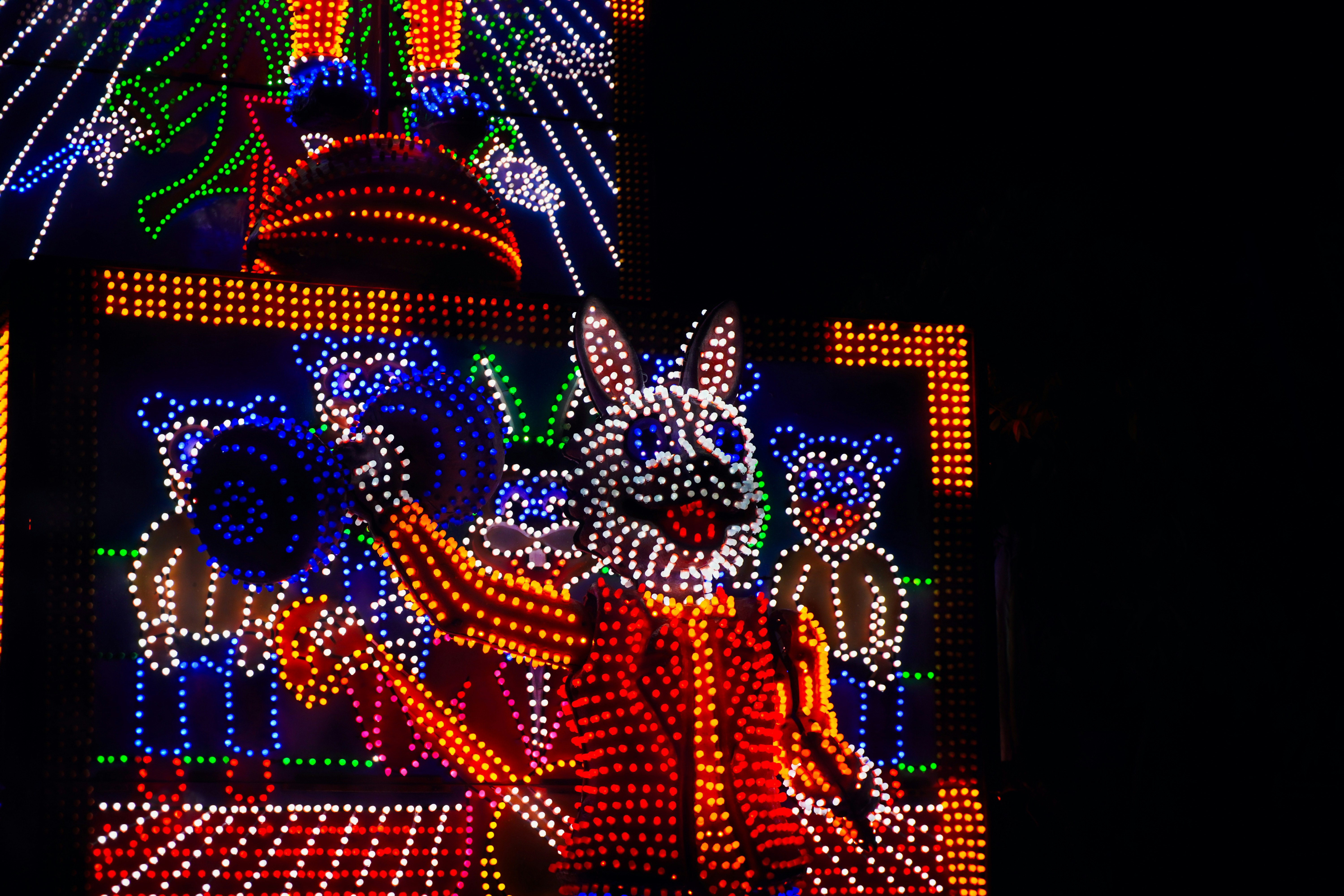 Neon Hare Parade: A Nighttime LED Cartoon Carousel