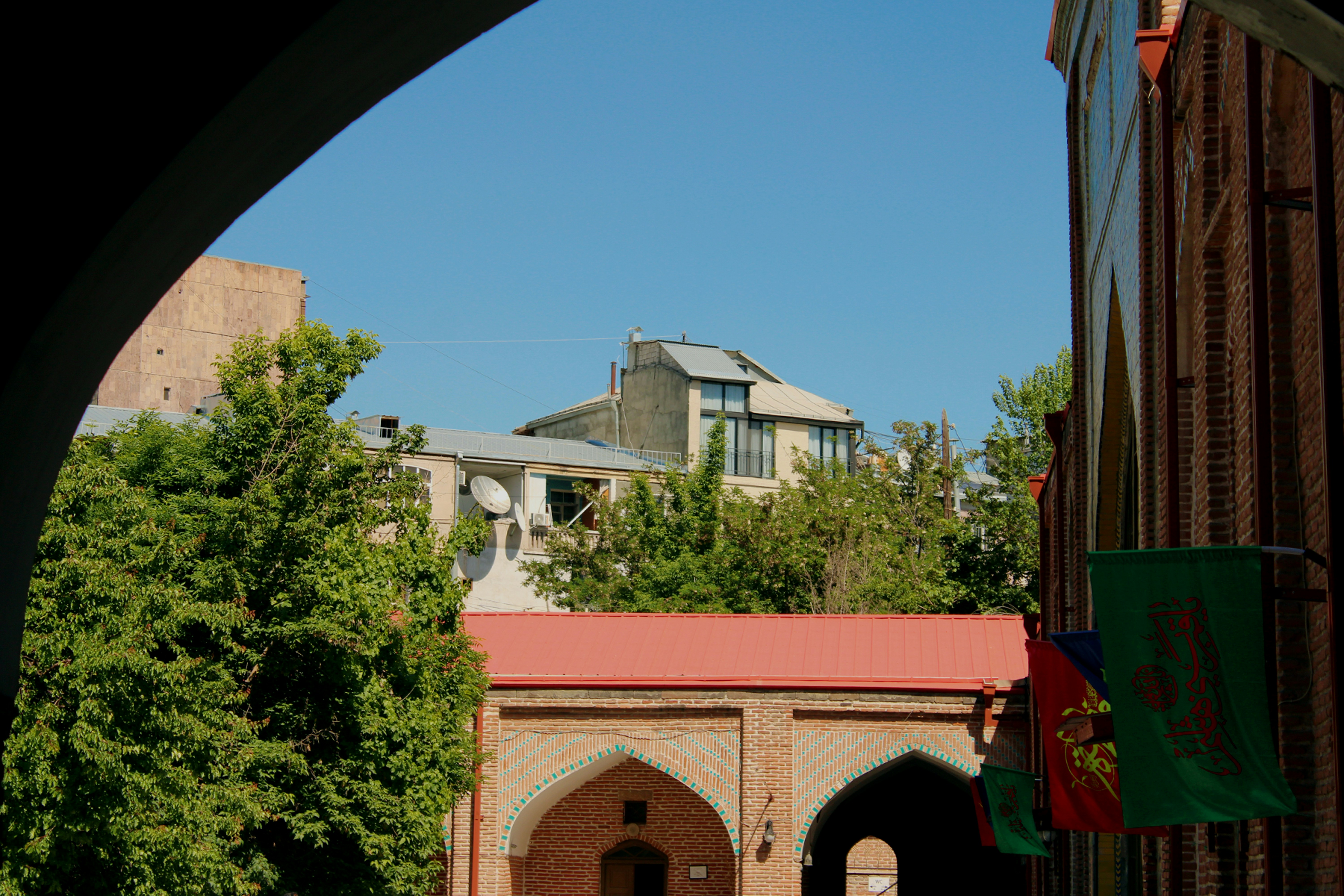 Urban Harmony: A Glimpse Through the Archway
