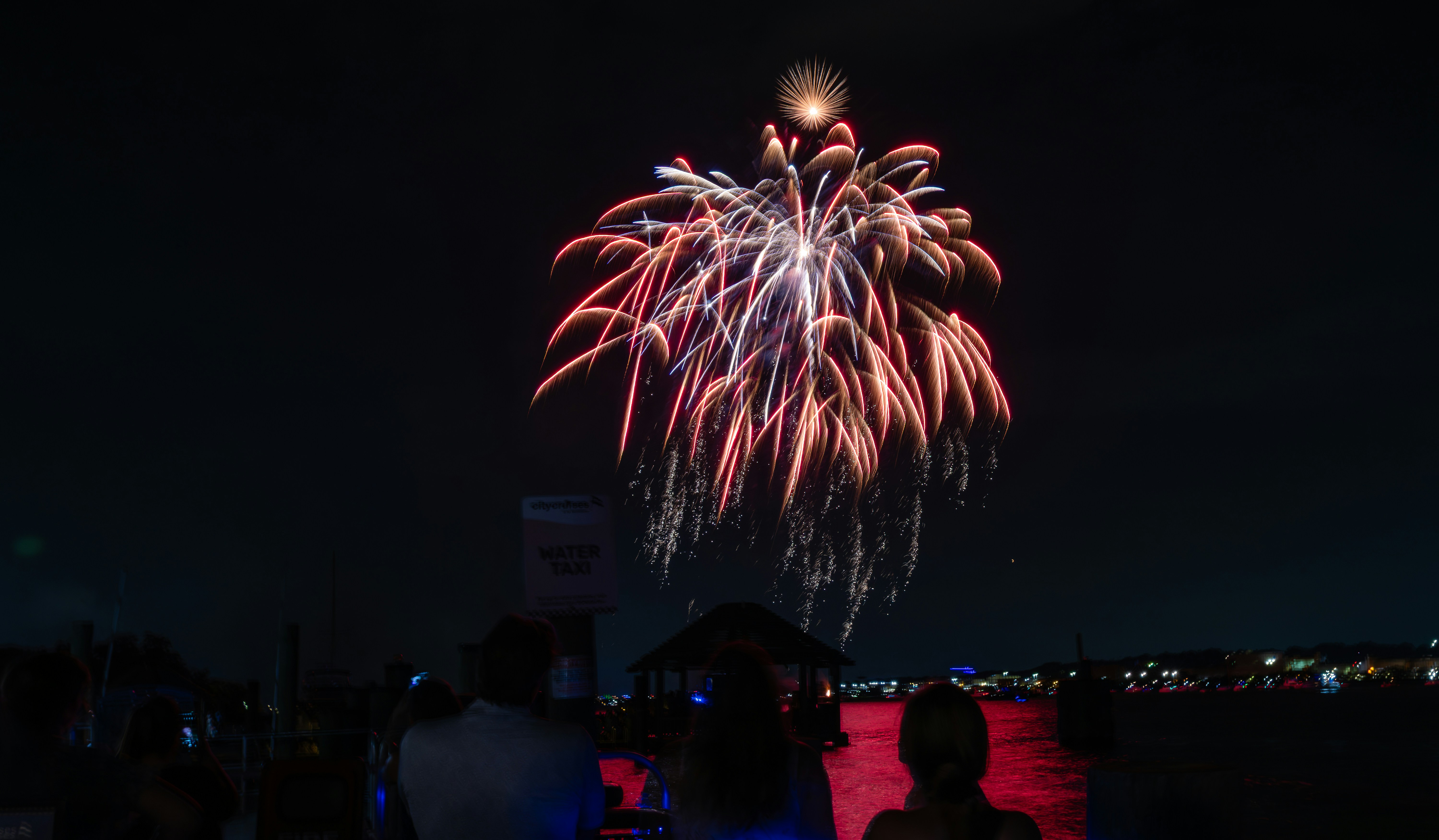 The City will celebrate its 276th and the USA’s 249th birthday on Saturday, July 12, at Oronoco Bay Park (100 Madison St.). Experience this one-of-a-kind Alexandria event with your family. The evening includes live music, food and drink vendors, and ends with the grand finale--a fireworks display on the Potomac River at 9:30 p.m. | Fireworks explode in the night sky over water.