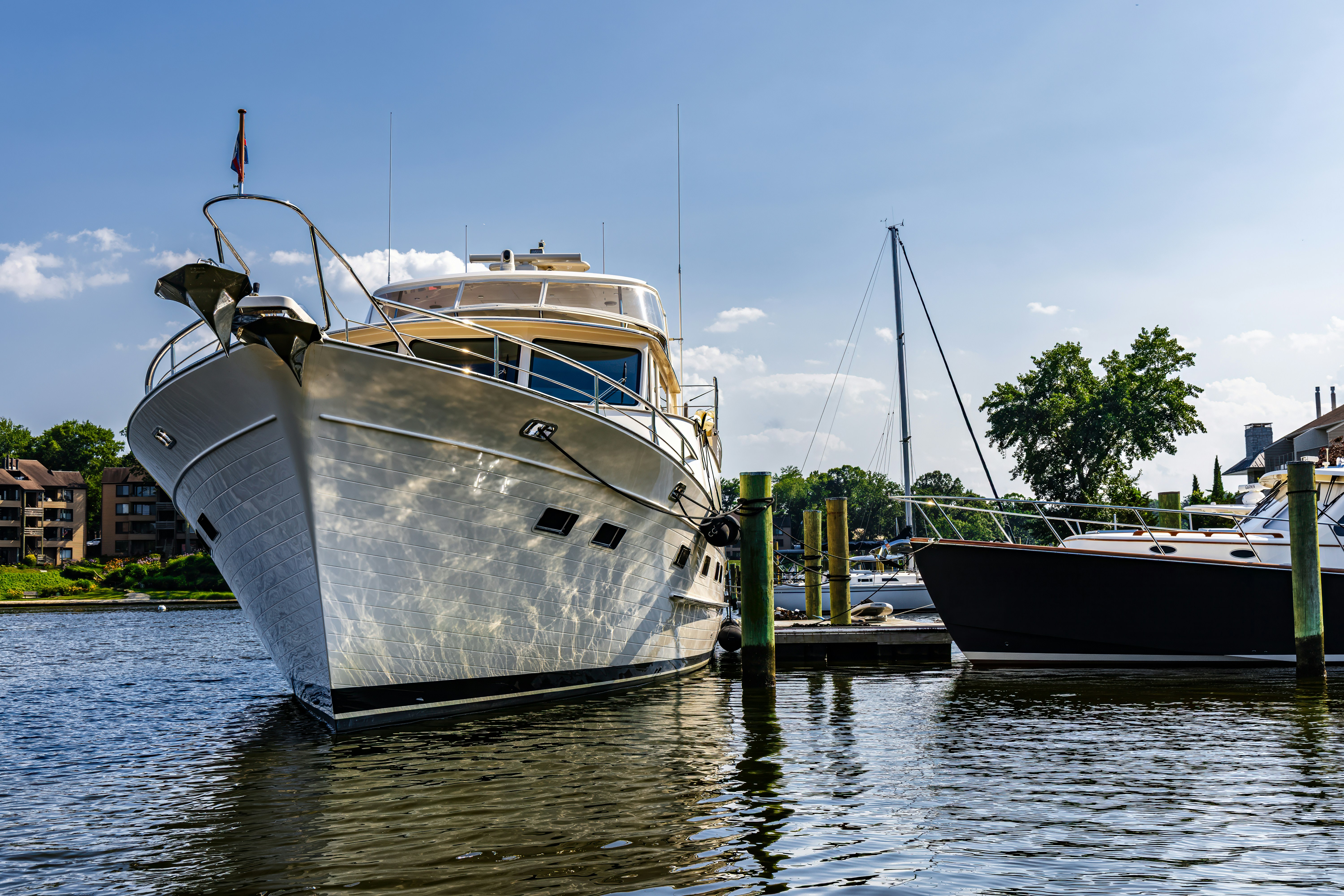 Annapolis (ə-NAP-əl-iss) is the capital of the U.S. state of Maryland. It is the county seat of Anne Arundel County and its only incorporated city. Situated on the Chesapeake Bay at the mouth of the Severn River, 25 miles (40 km) south of Baltimore and about 30 miles (50 km) east of Washington, D.C., Annapolis forms part of the Baltimore–Washington metropolitan area. The 2020 census recorded its population as 40,812, an increase of 6.3% since 2010. | Luxury yacht docked at a marina on a sunny day.