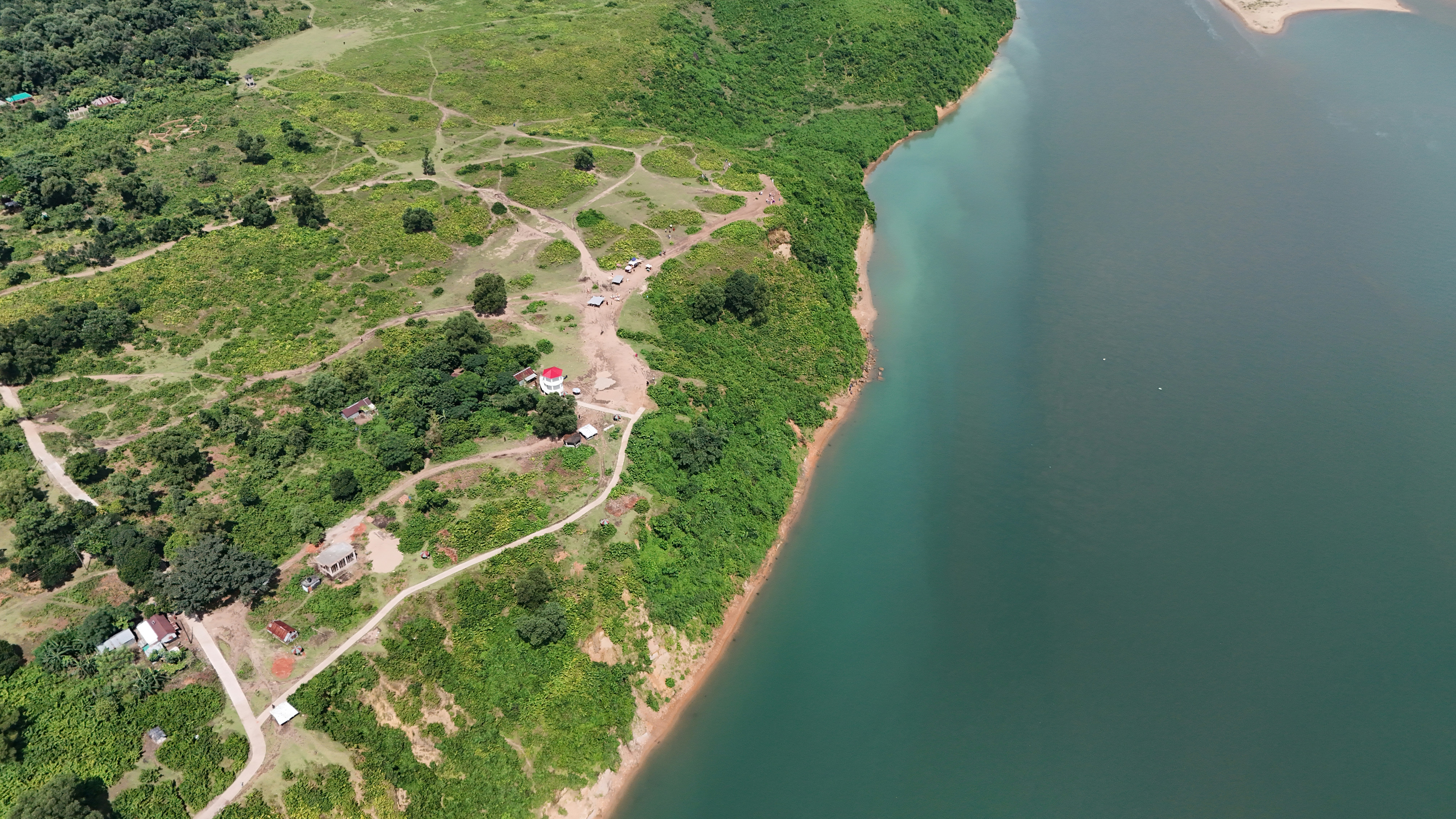 Travel View of Bangaldesh. | Aerial view of a coastline with green vegetation and water.