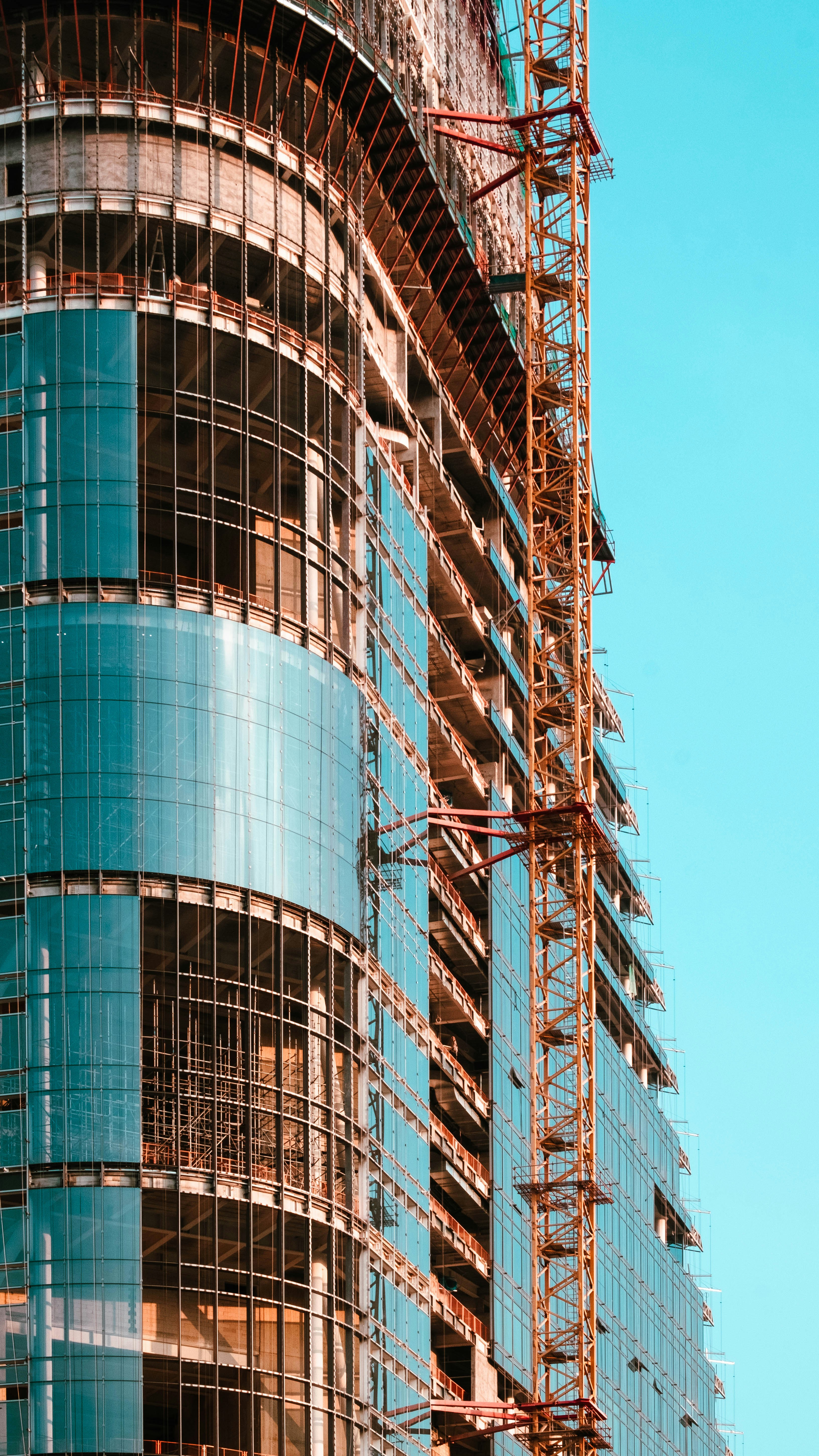Vivo center (constructing) | Modern skyscraper under construction against blue sky