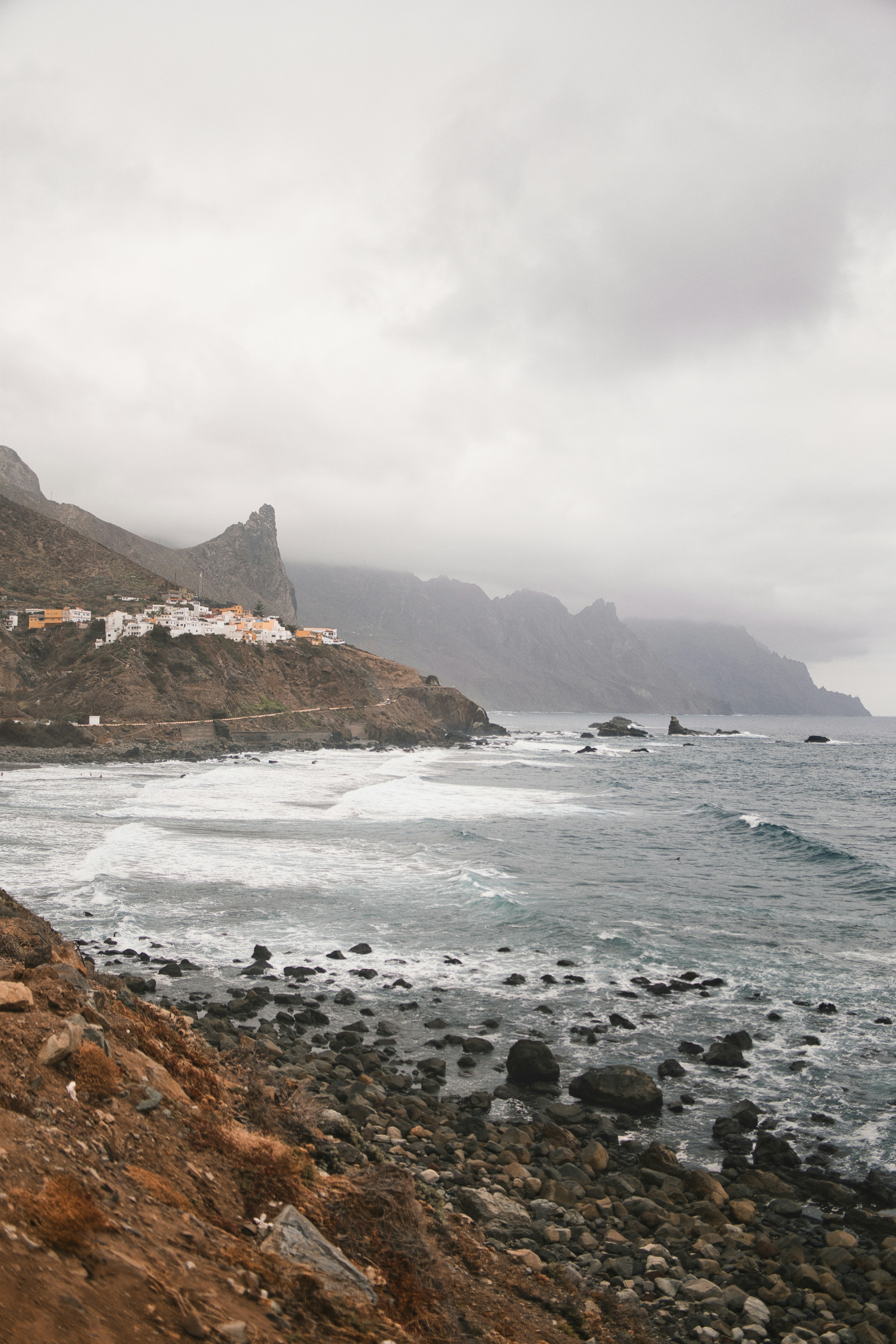 Coastal Serenity Amidst Mountain Shadows