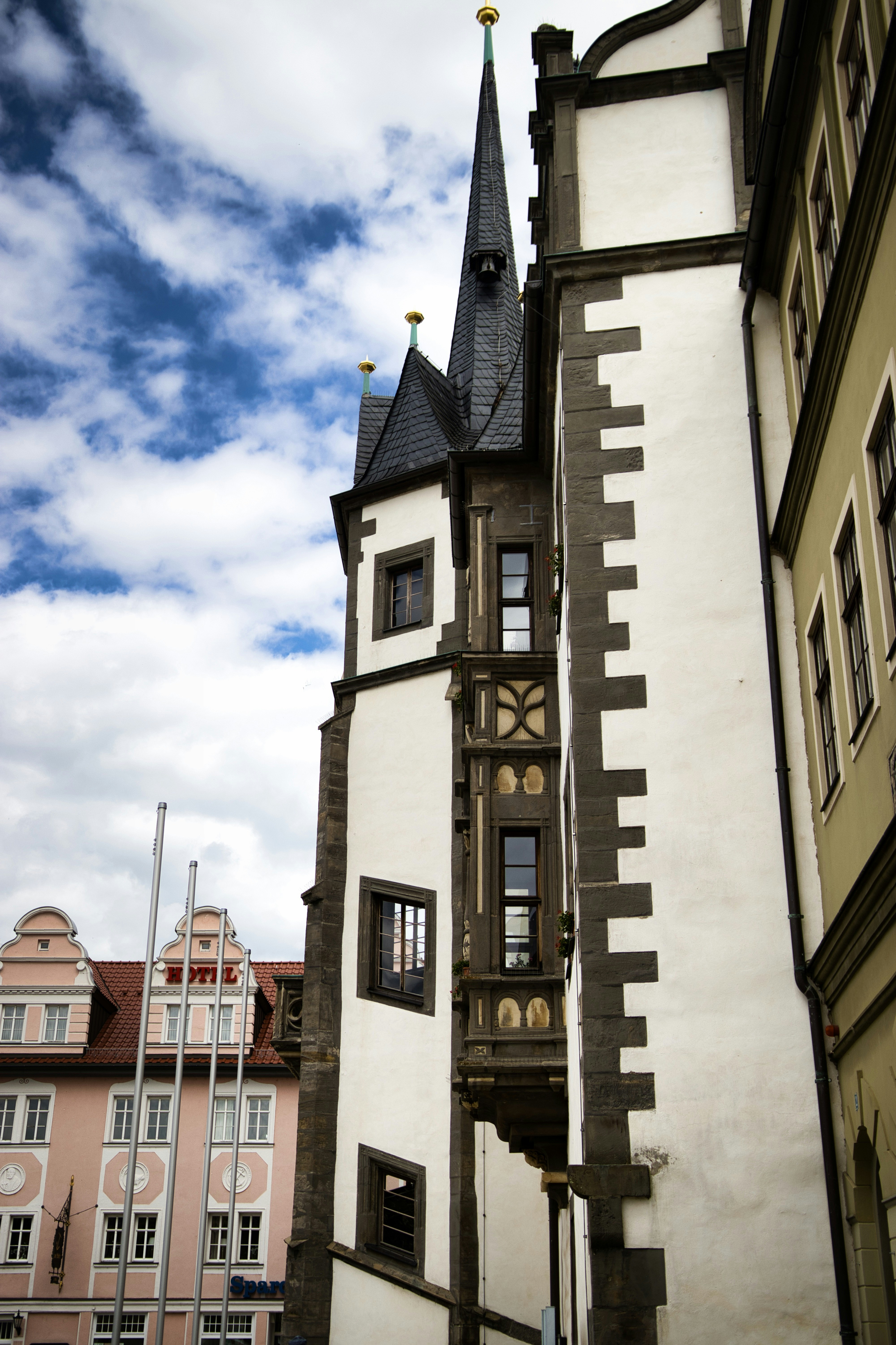 Historic building with ornate windows and spire