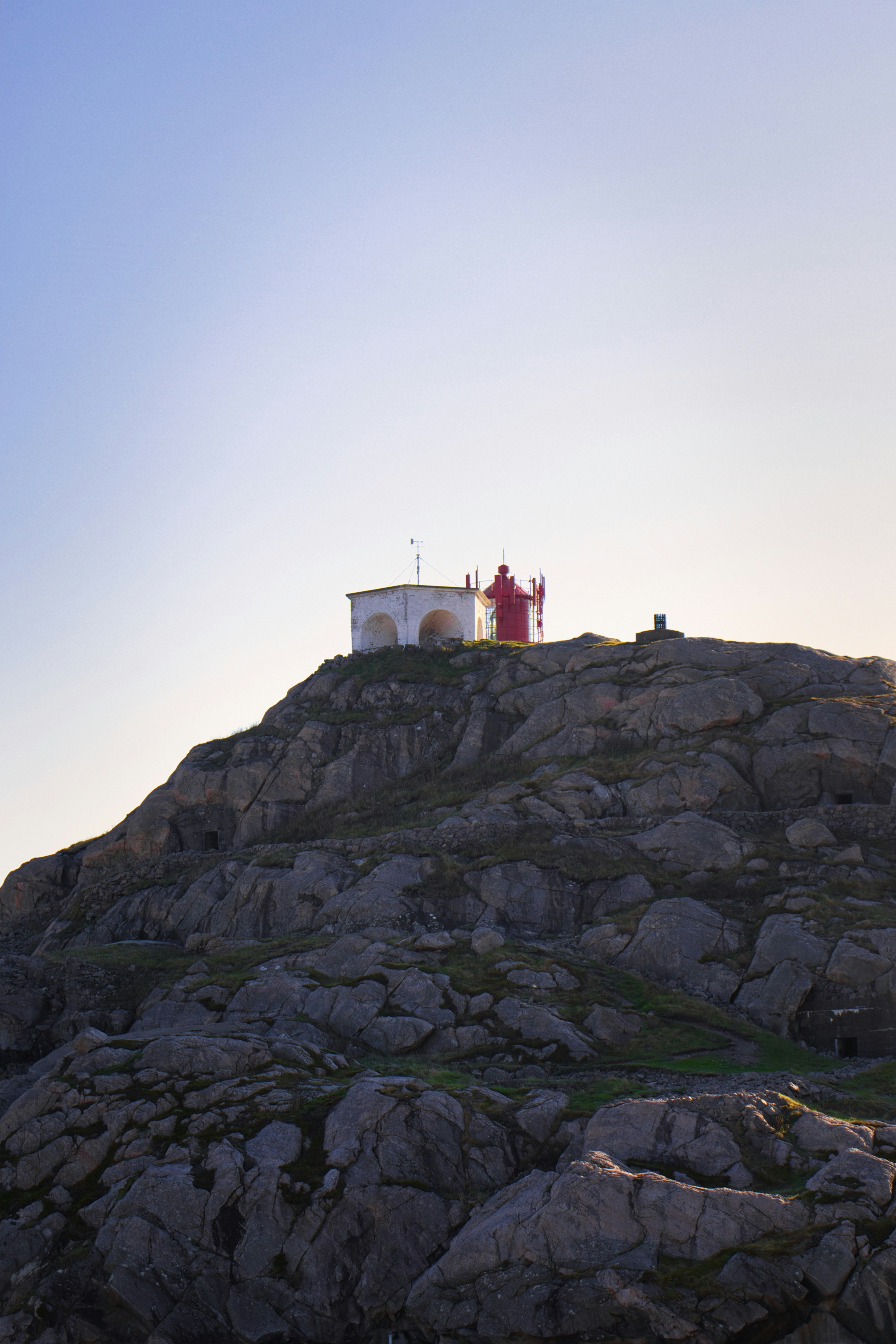Sentinels of the Summit: A Beacon Amidst the Rocks