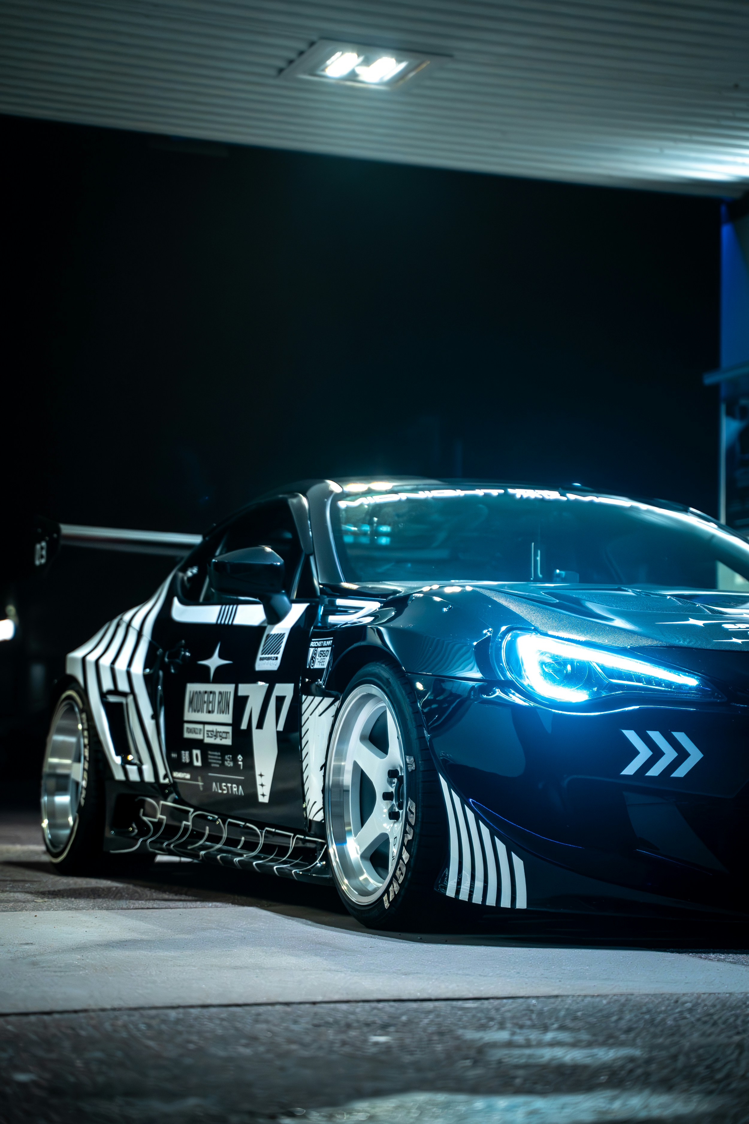 Modified sports car with racing decals at night photo – Free Sports car ...