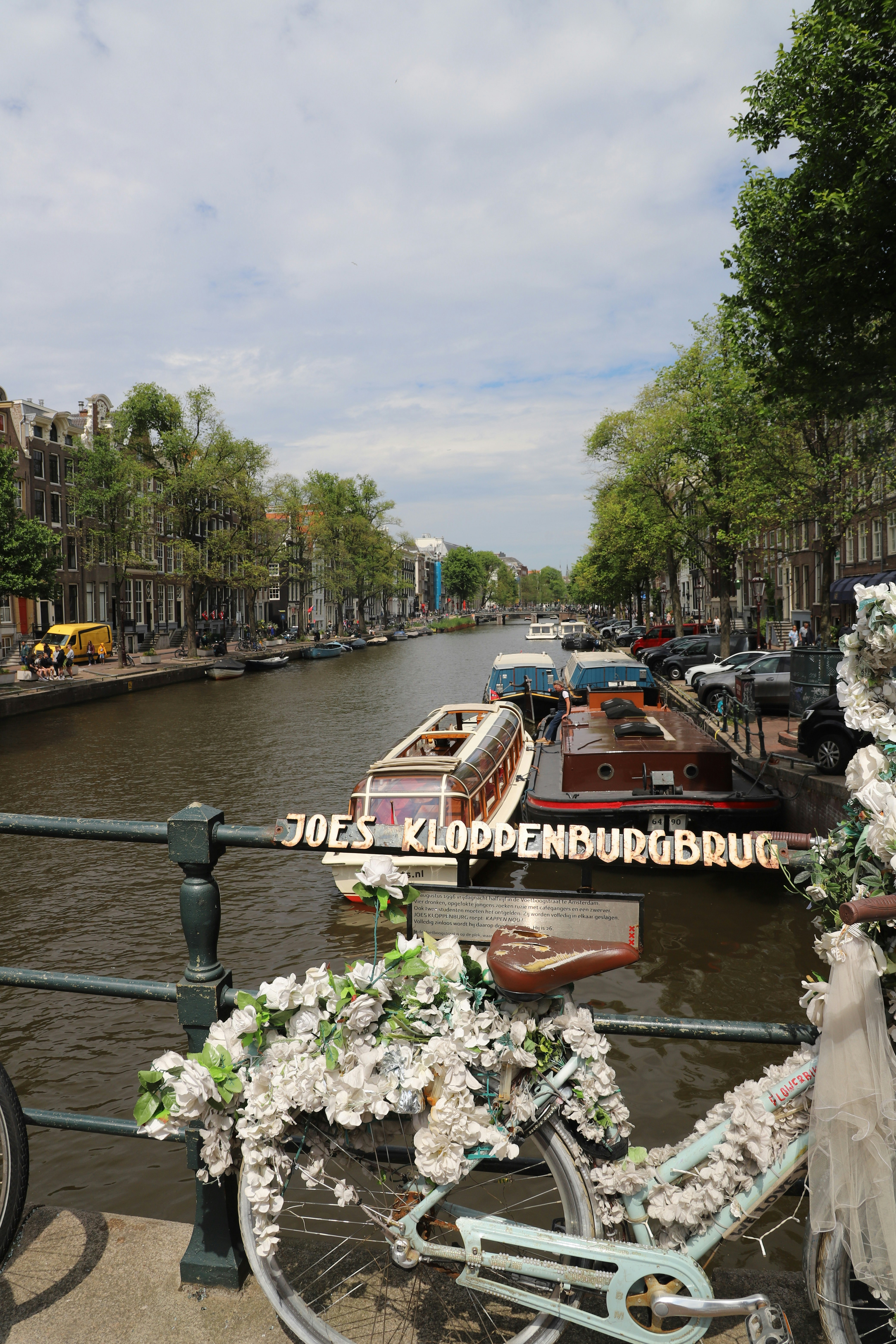 Floral Railings Over Amsterdam’s Canal at Kloppenburgbrug