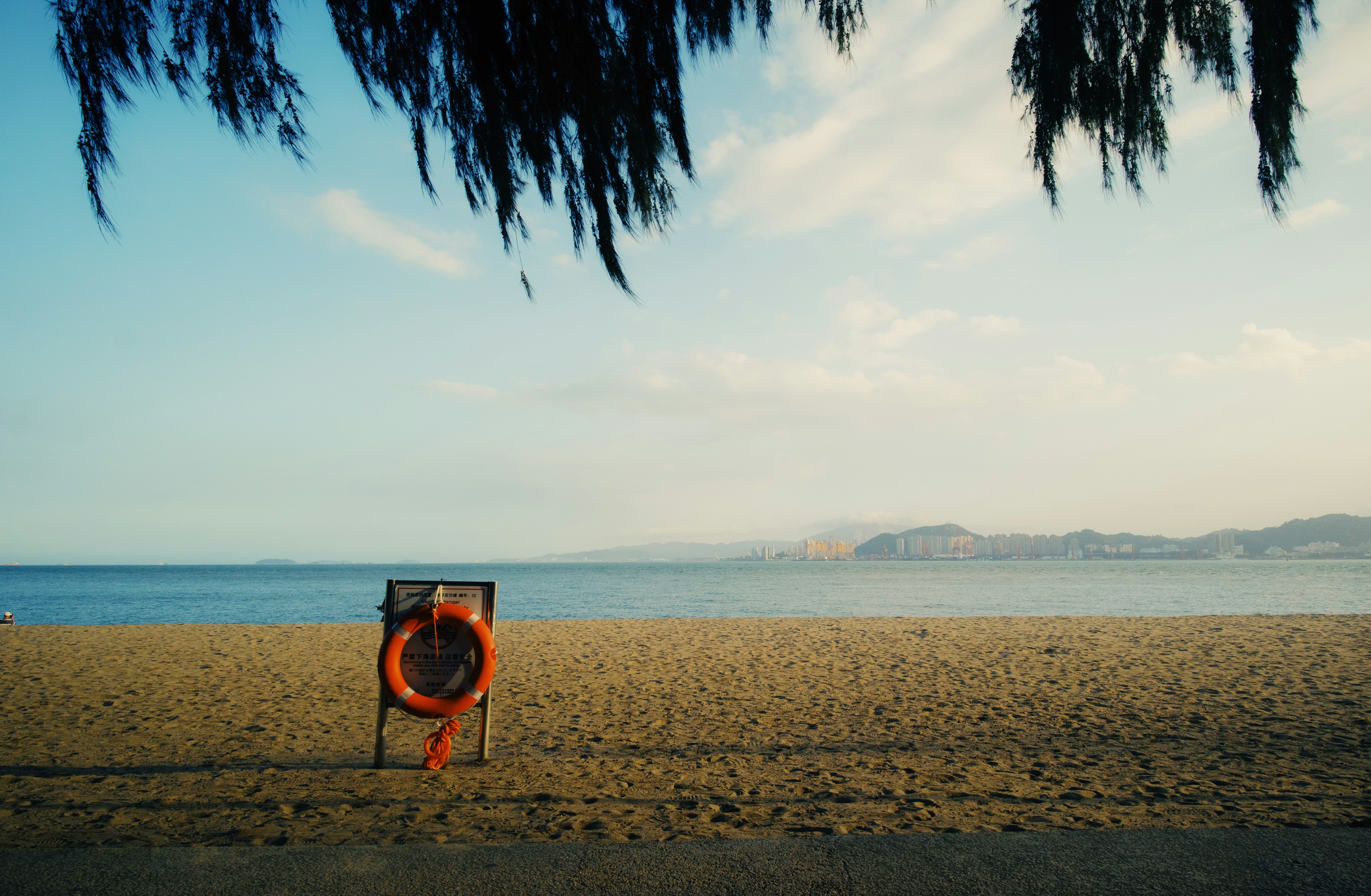Rescue Ready: A Lifebuoy's Vigil on Serene Shores