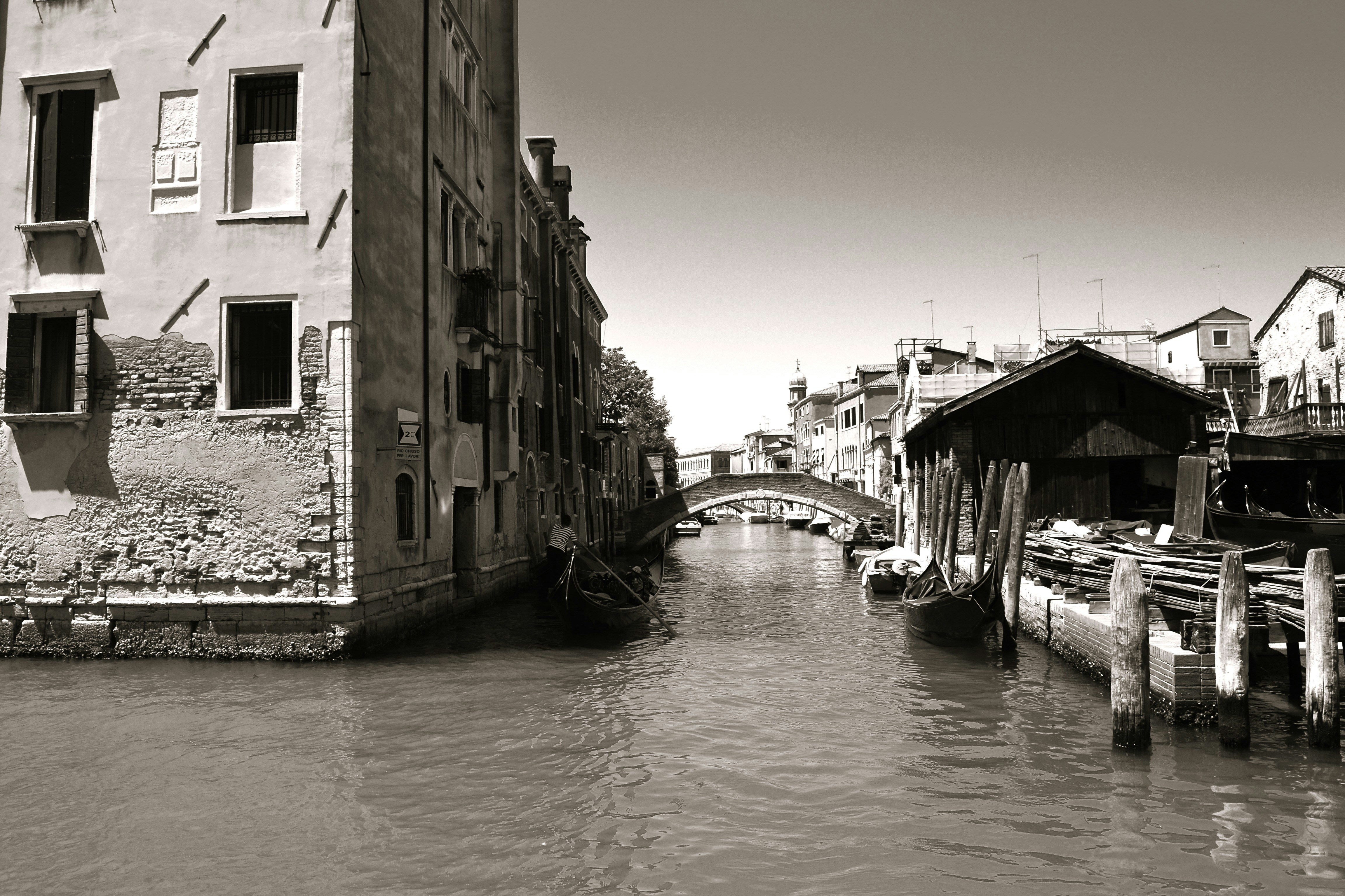 Venice canal with old buildings and boats