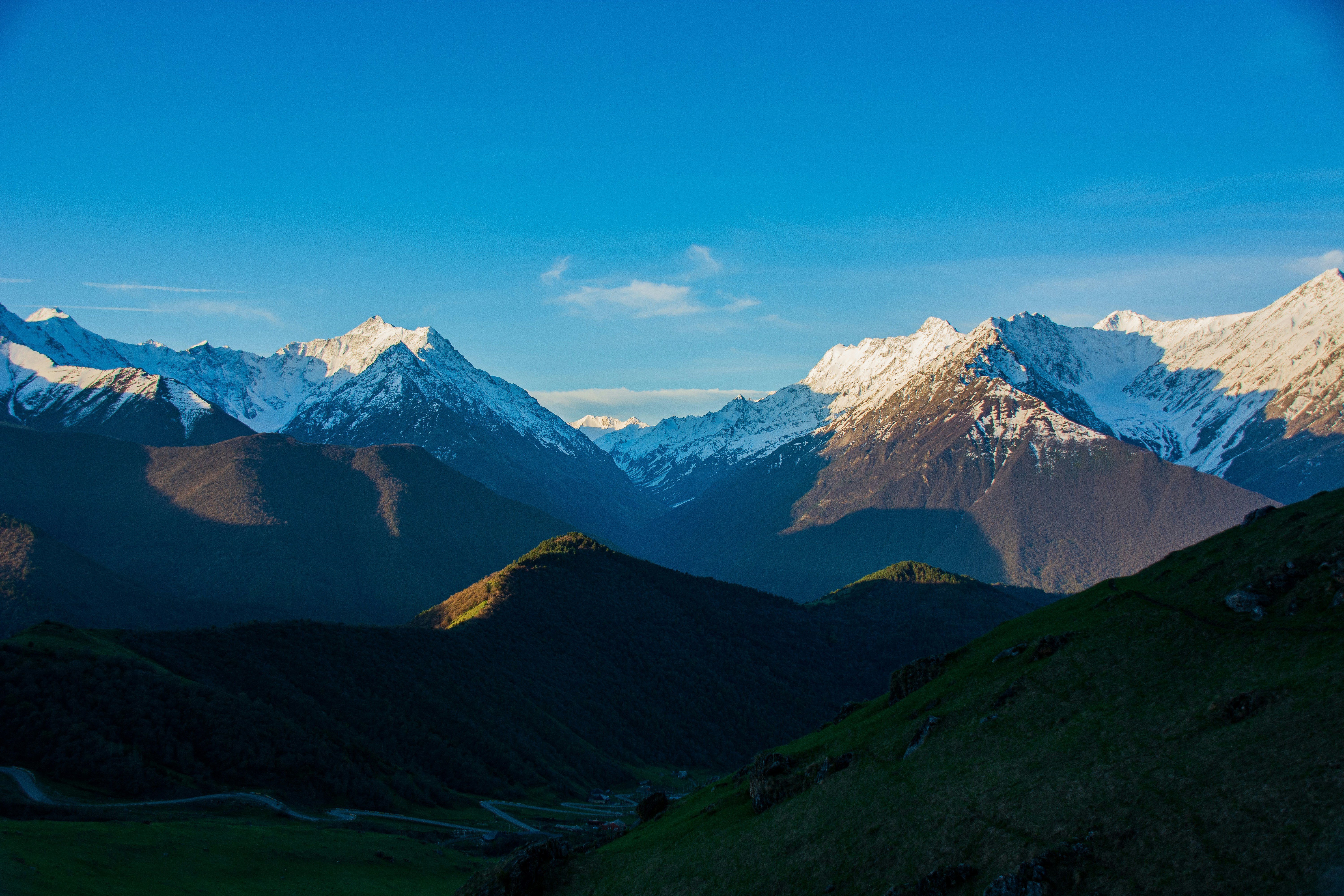 Snow-capped mountains under a clear blue sky.