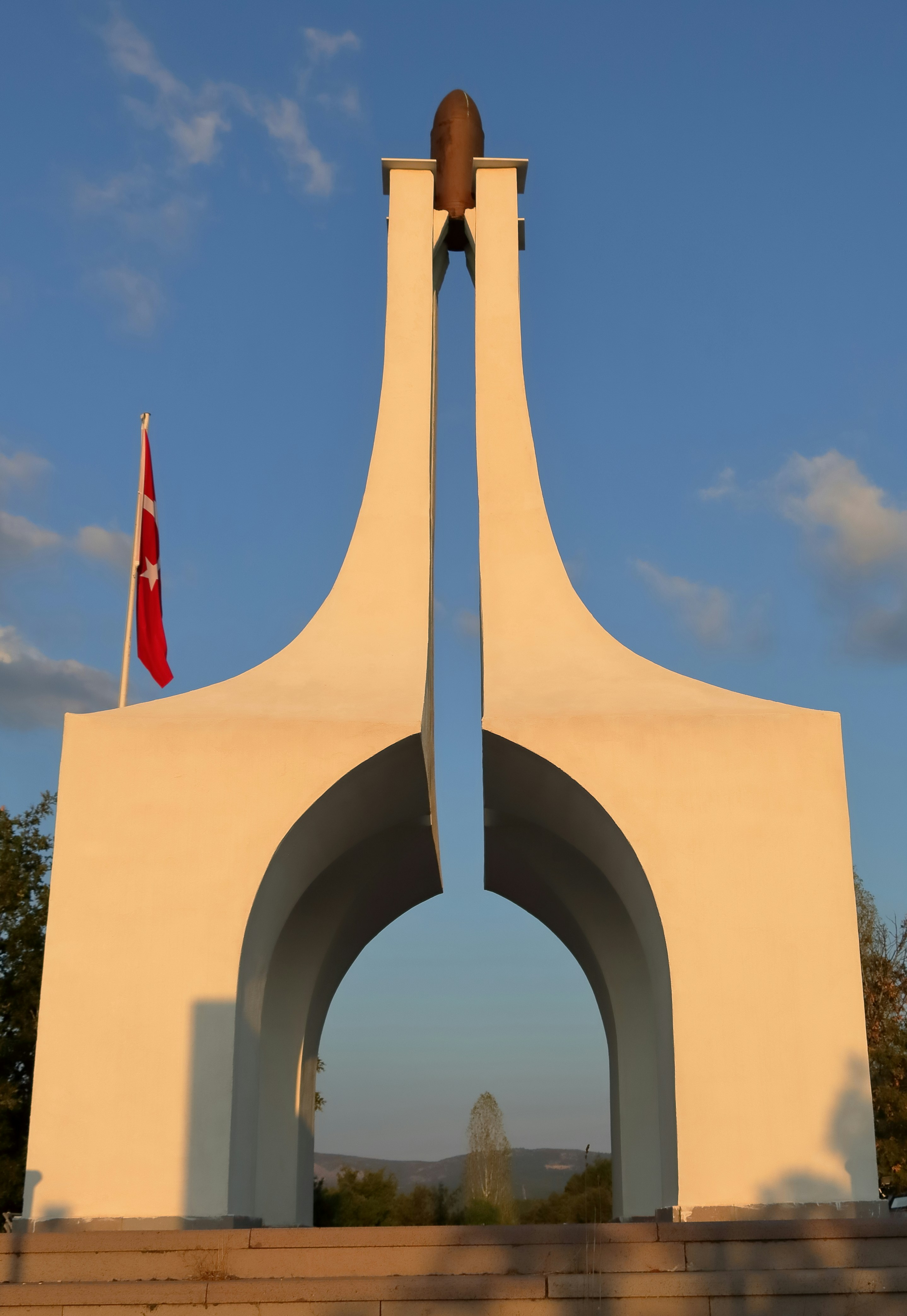 Modern white monument with danish flag