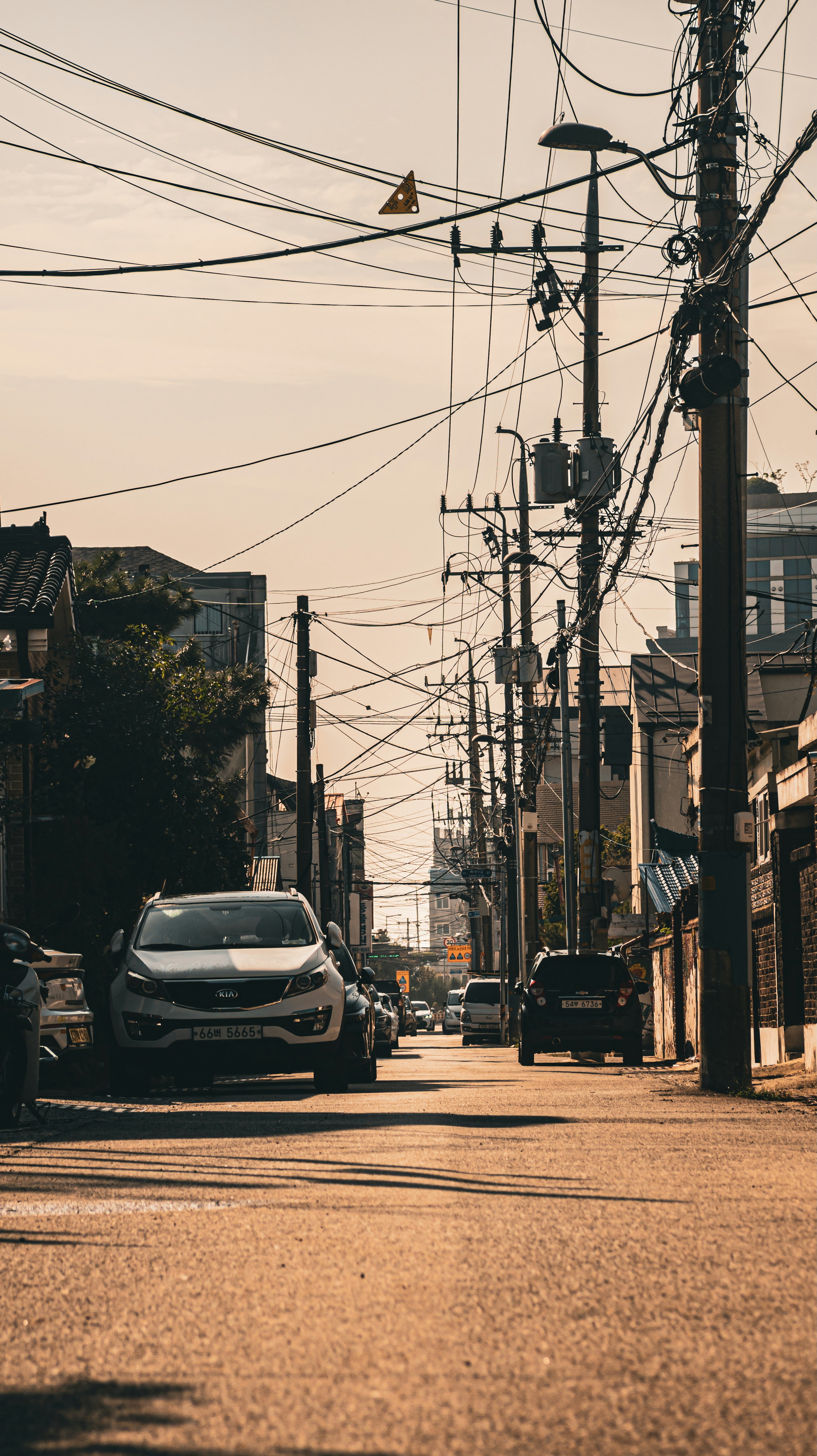 Street with cars and tangled power lines
