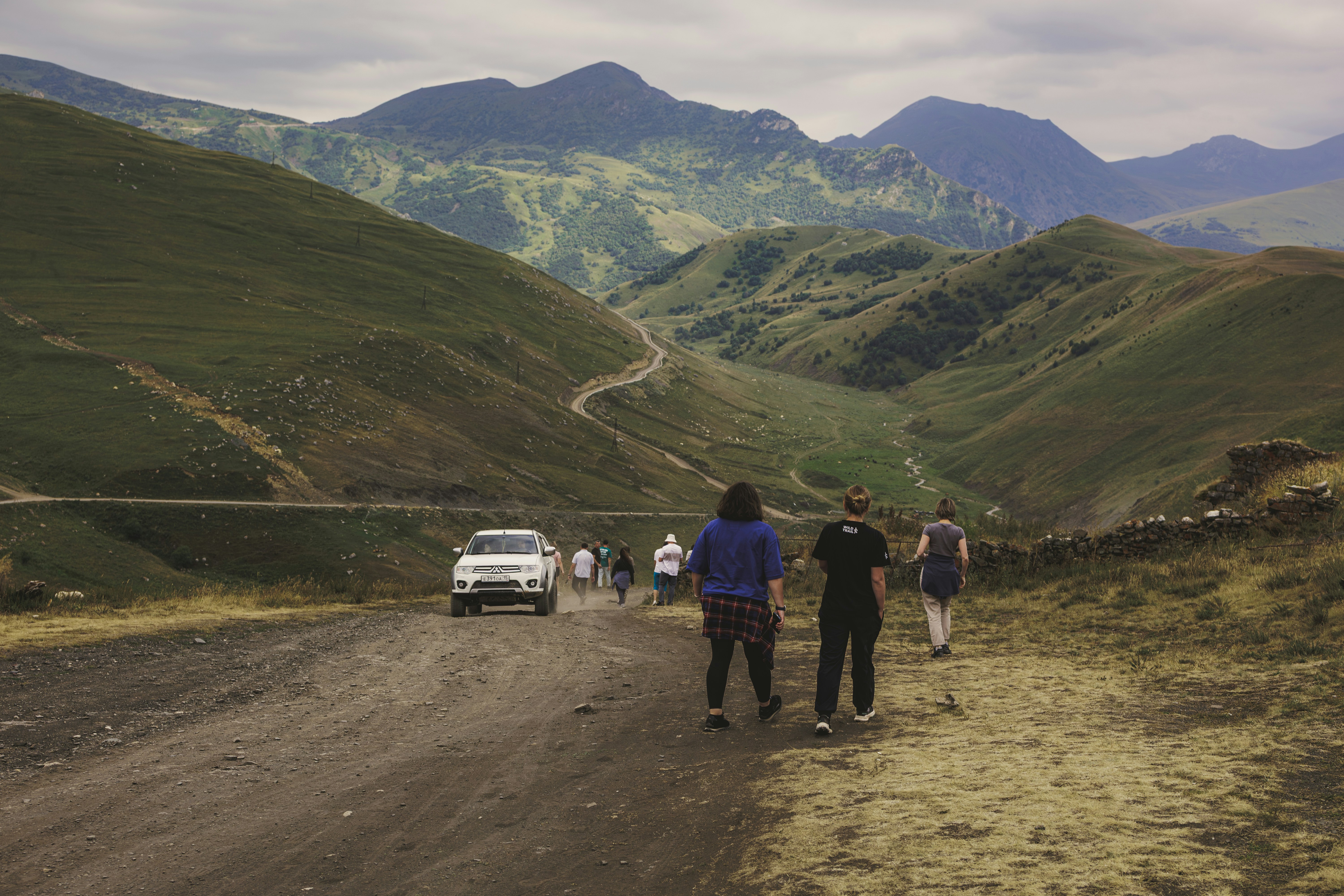 Wind-Kissed Ridge: A Group Trek Along a Highland Dirt Road