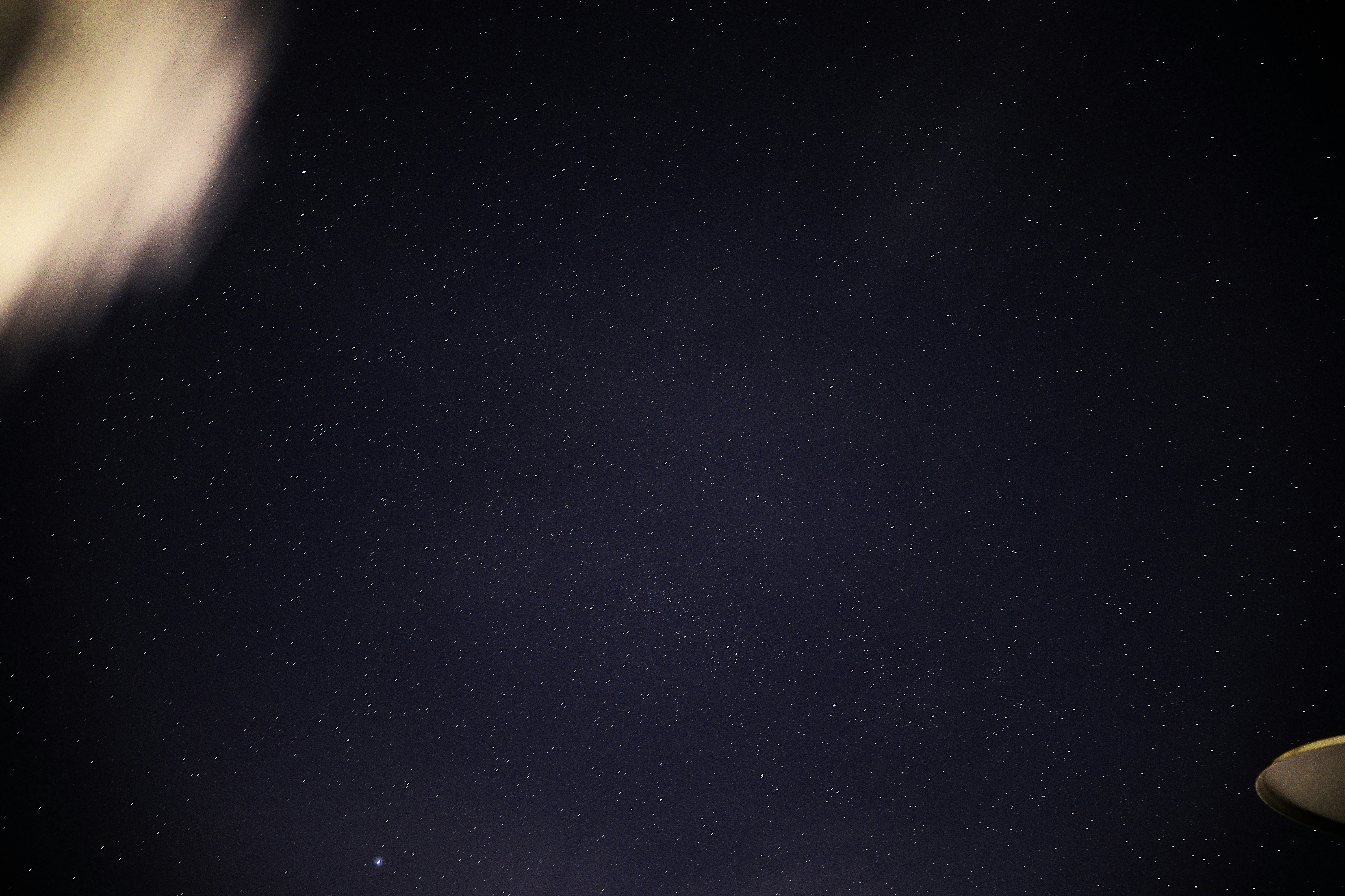 A dark sky filled with countless white stars.