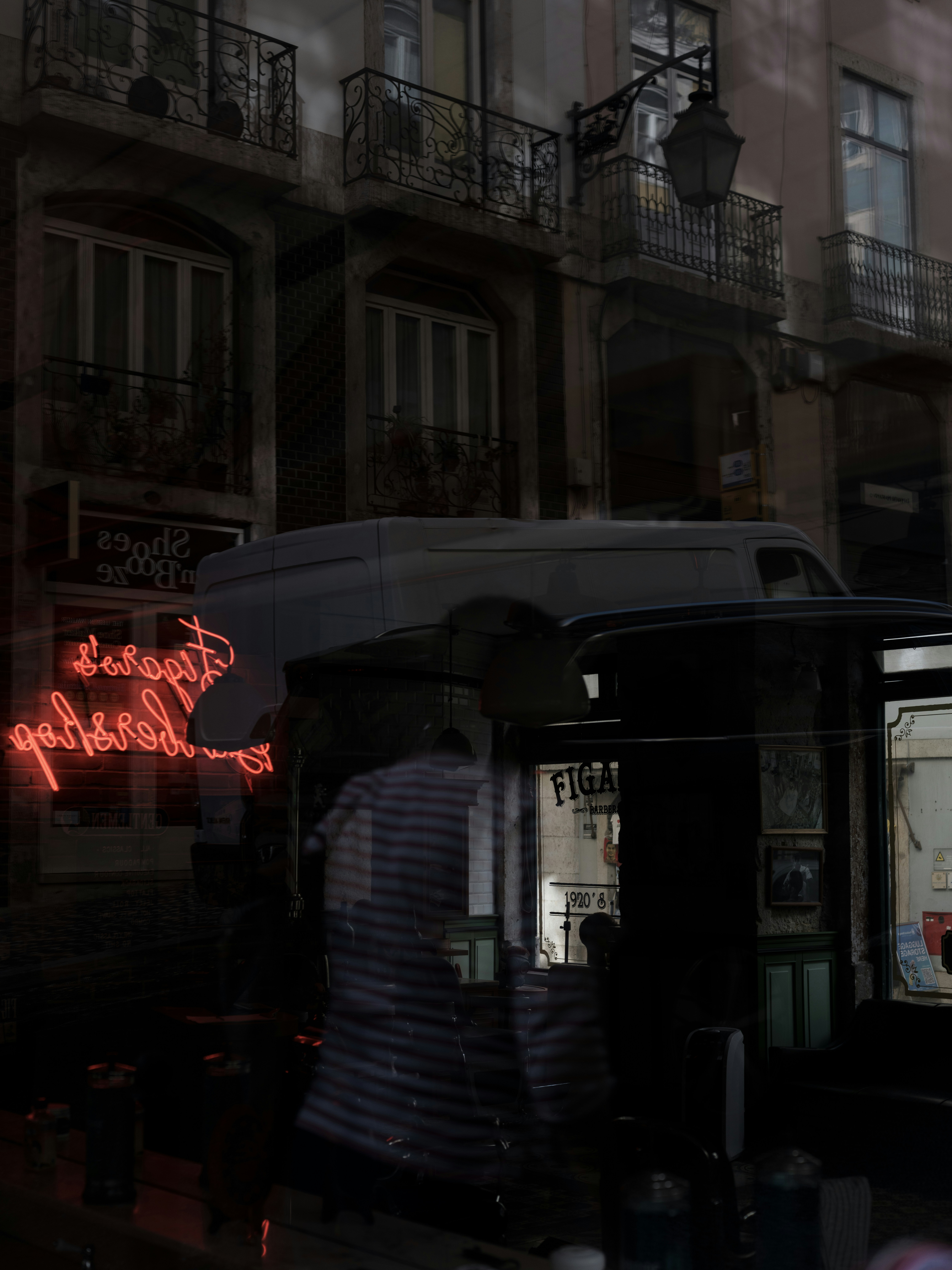 Neon Echoes Through a Rain-Dark Window
