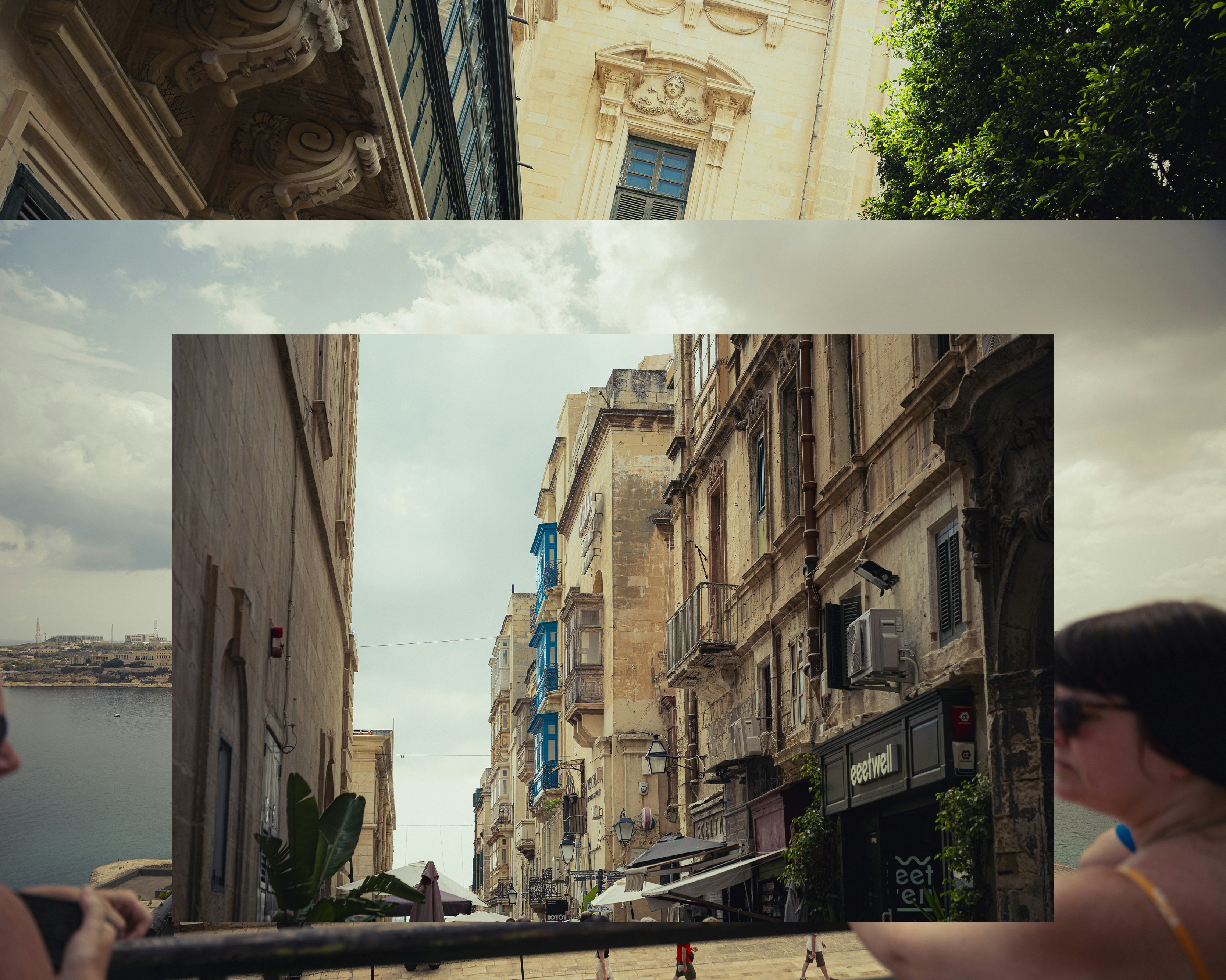 Historic european street with ornate buildings and sky.