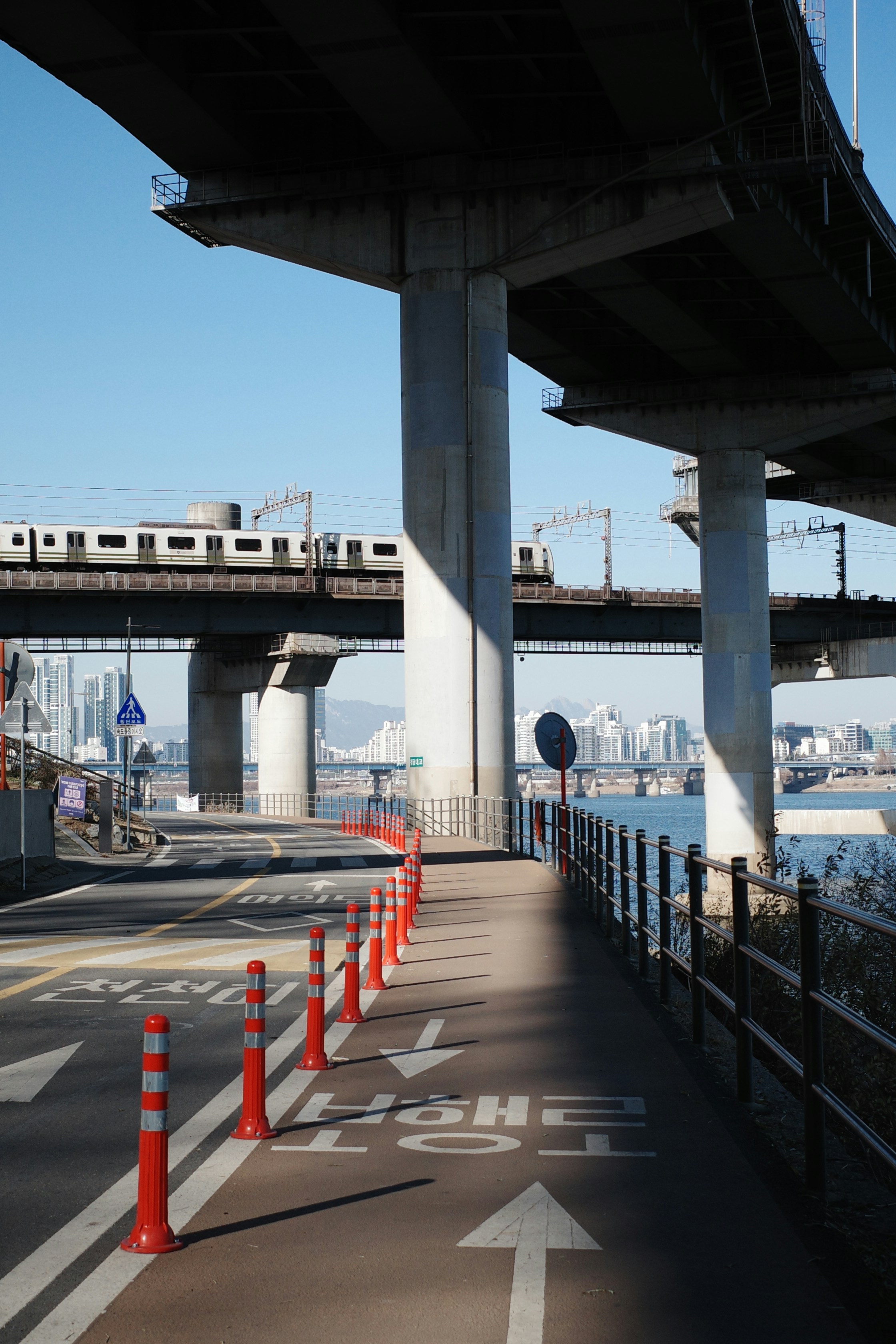 Cones, Pillars, and Rails: A Waterfront Passage Toward the City