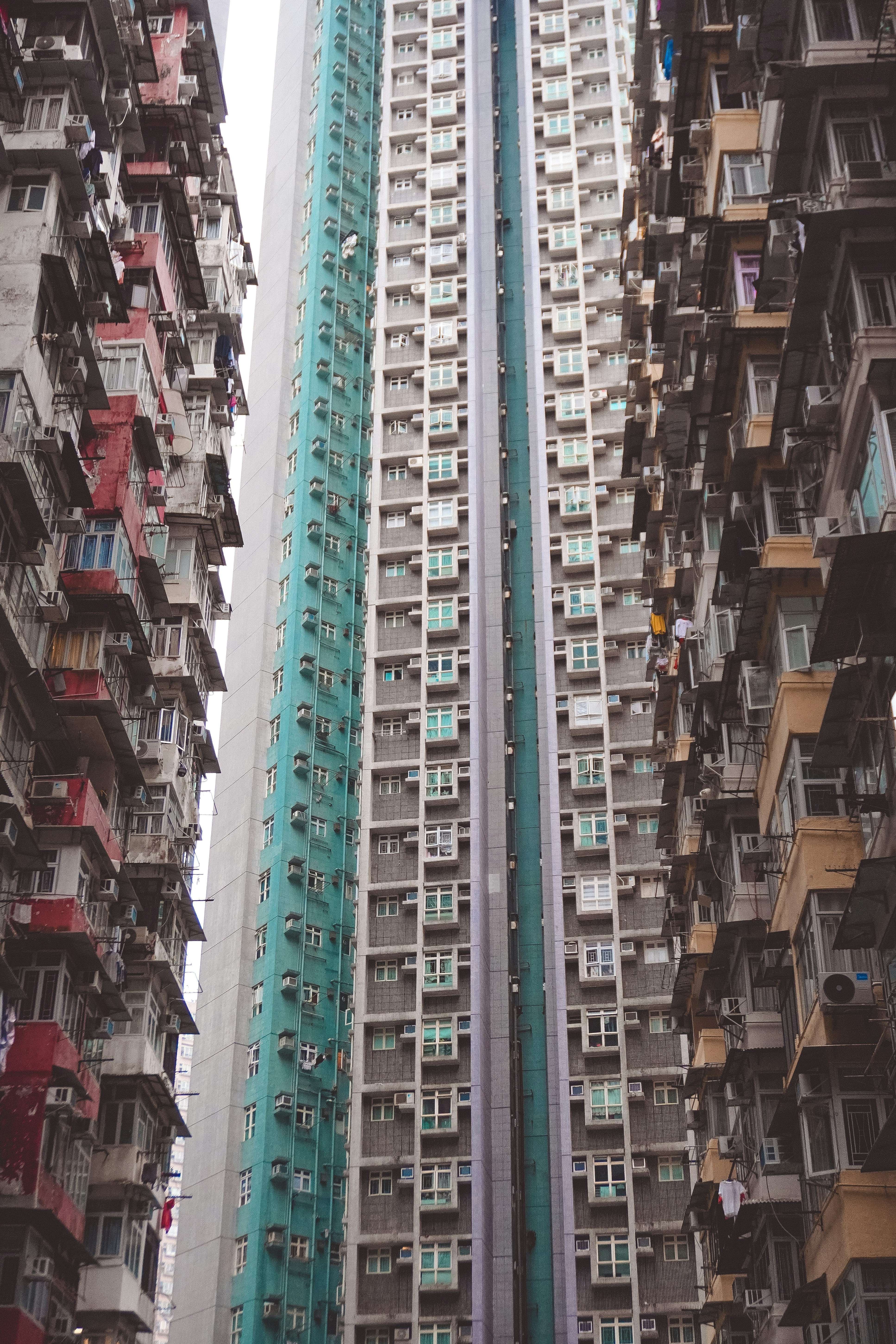 Tall apartment buildings packed closely together photo – Free ...