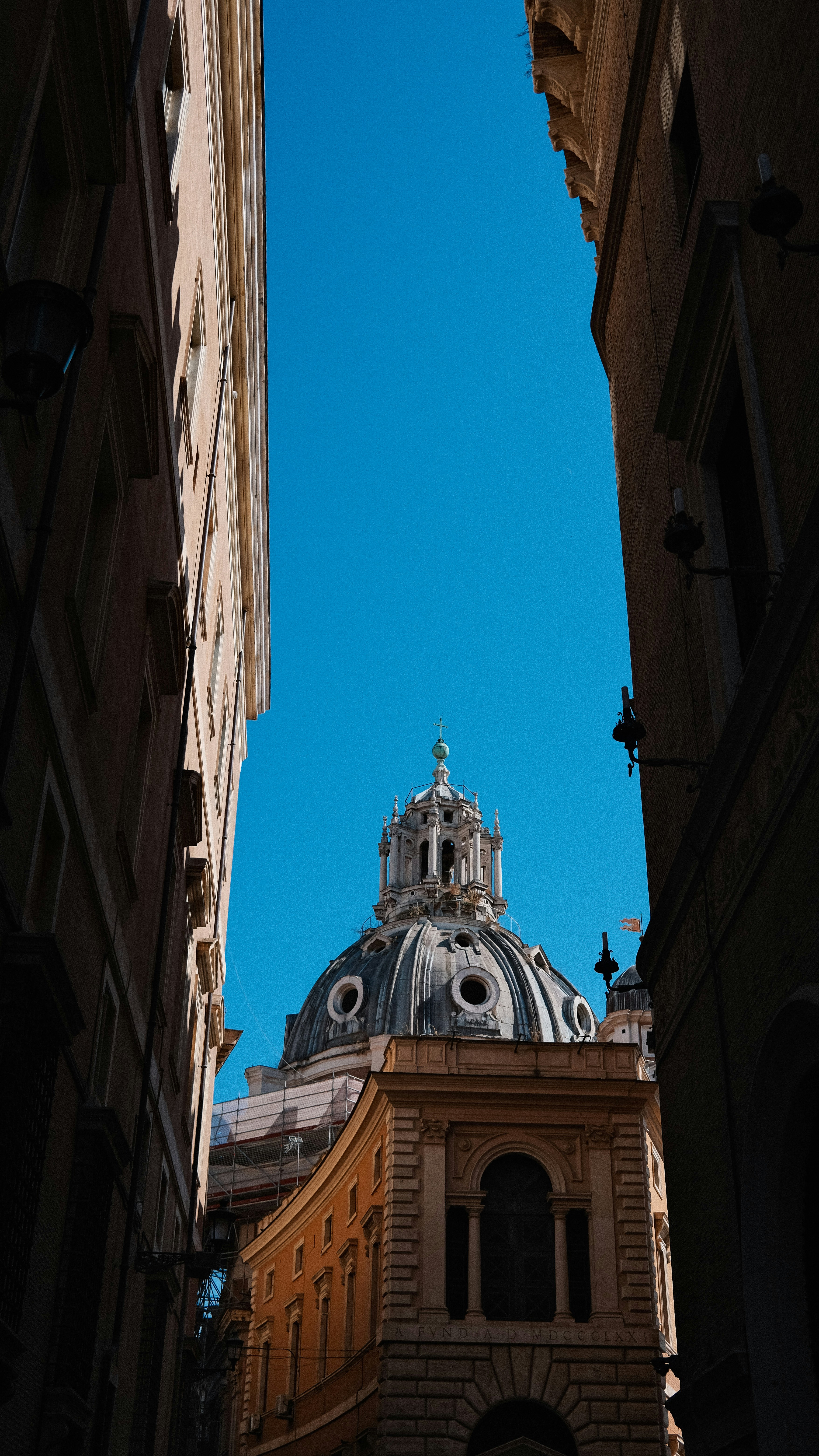 Dome of a building seen between two walls