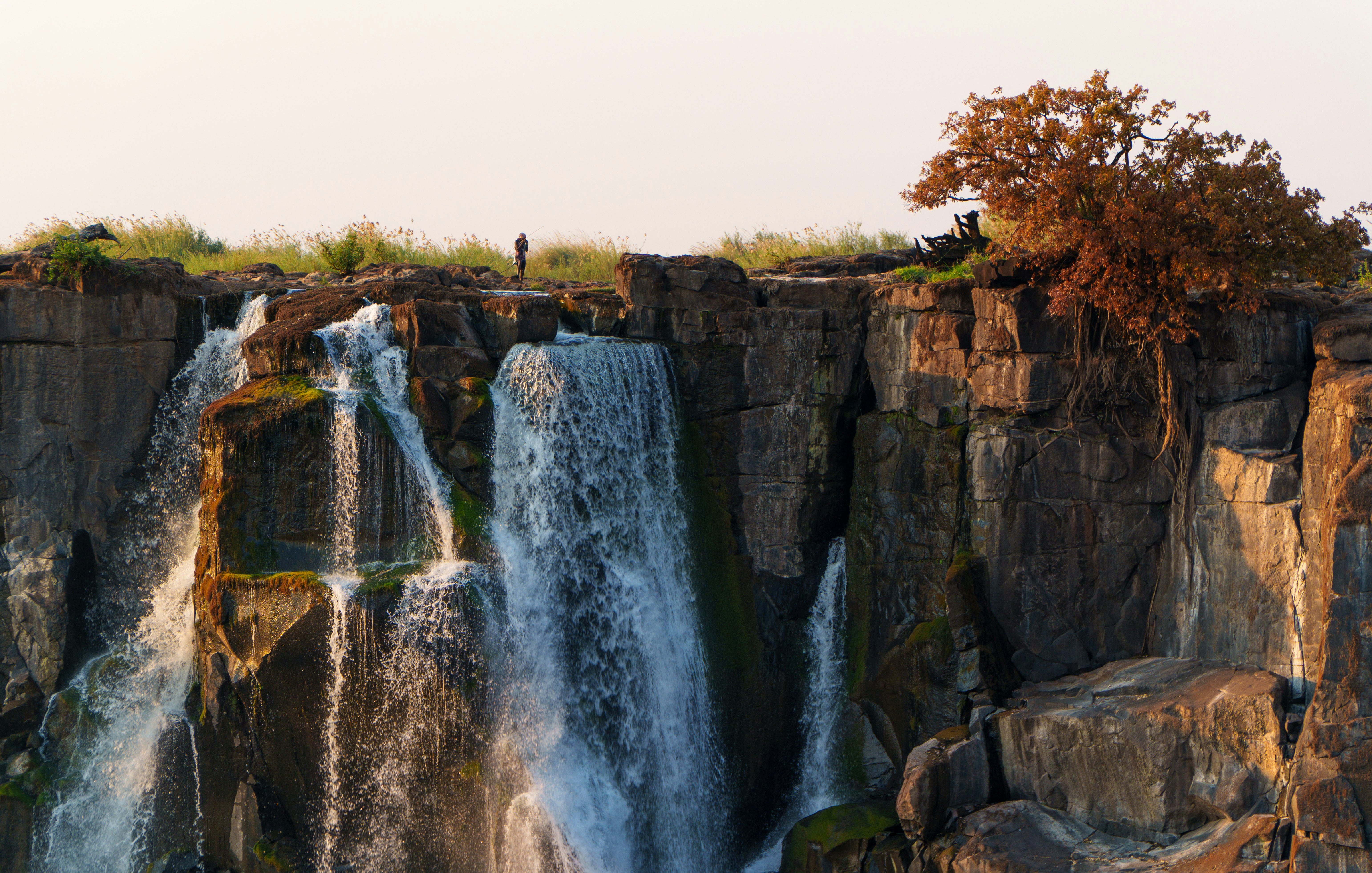 Dusk Cascade: Narrow Falls Framed by Weathered Granite