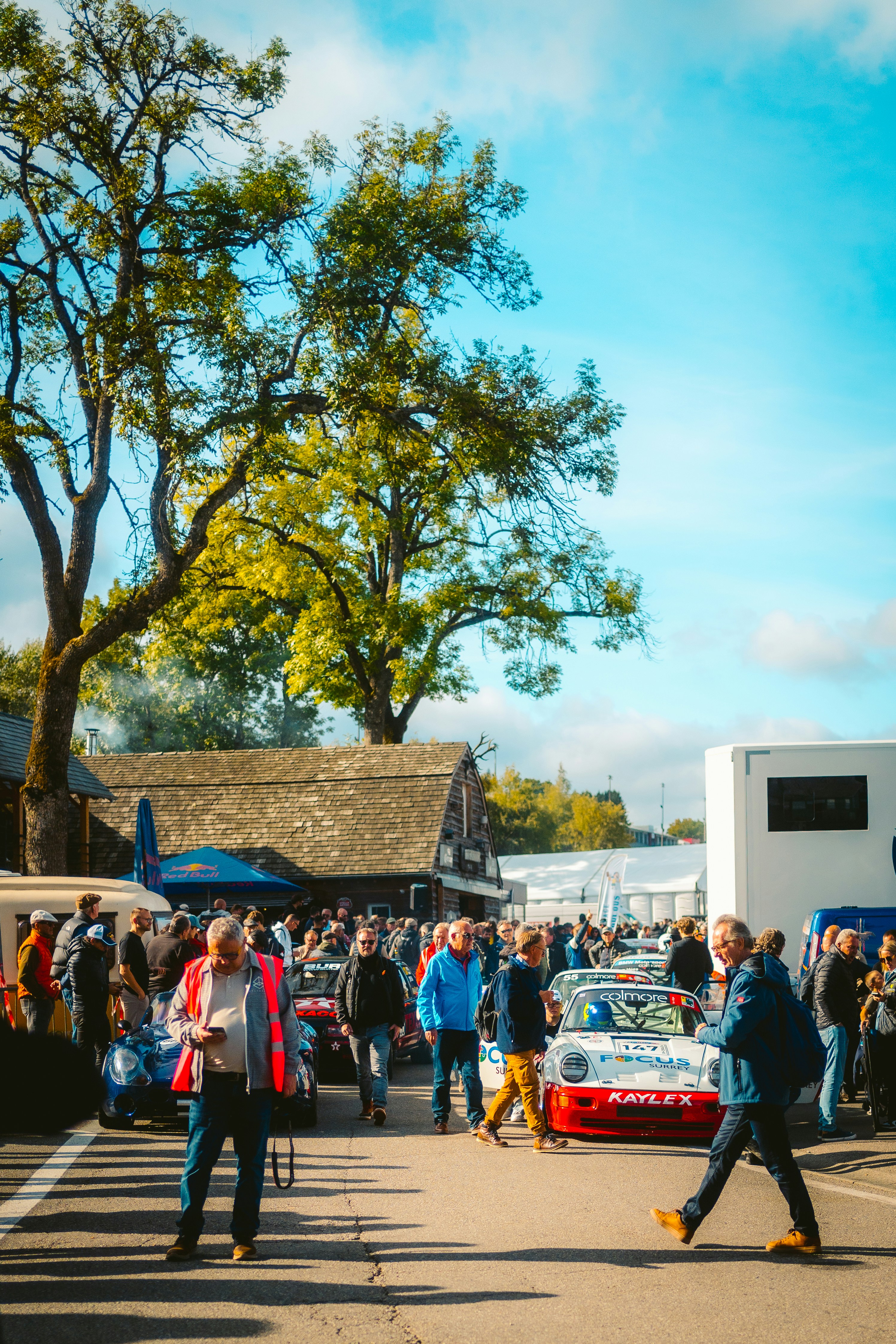 Crowd and Racing Car Rally at Sunlit Showground