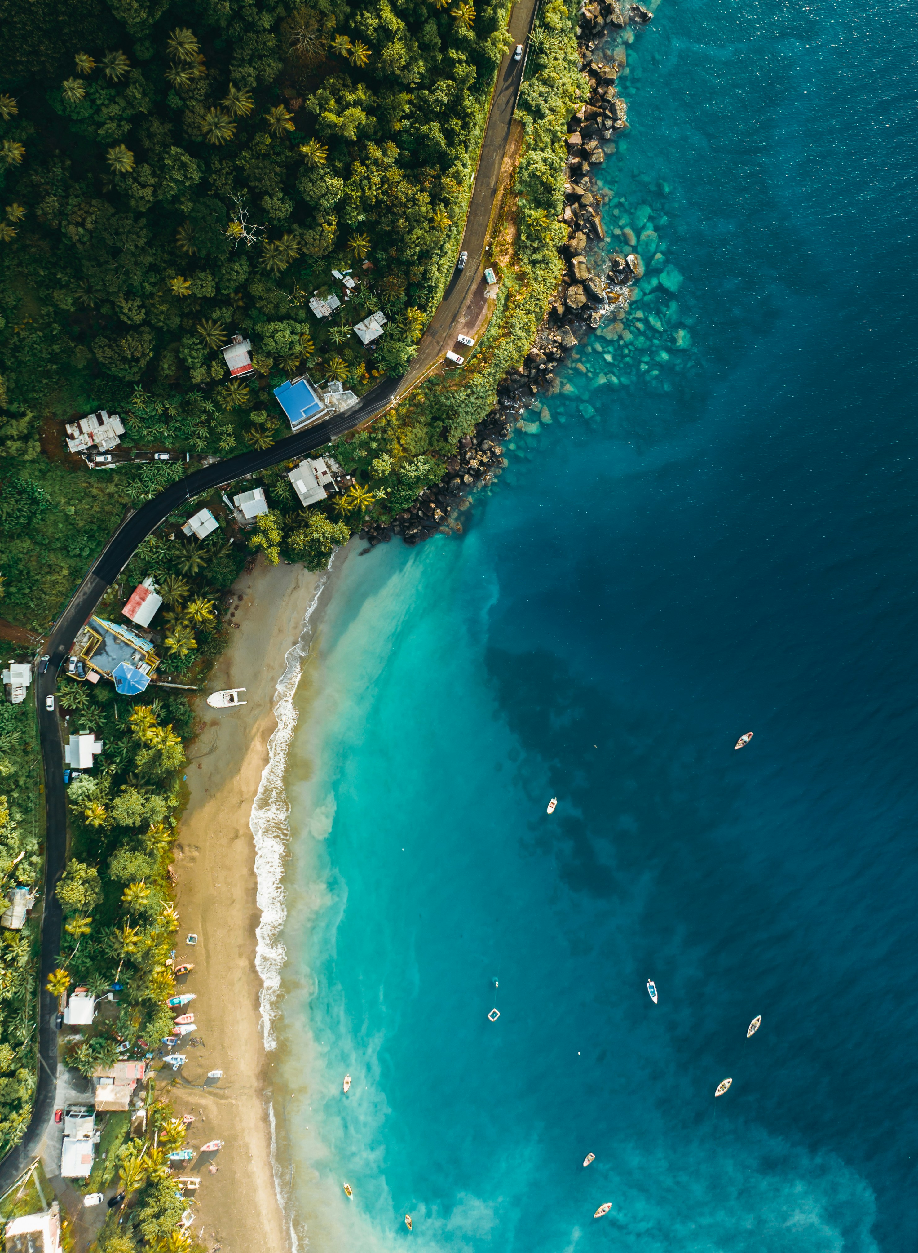 Duquense Bay | Grenada | Aerial view of coastal village and turquoise ocean with boats