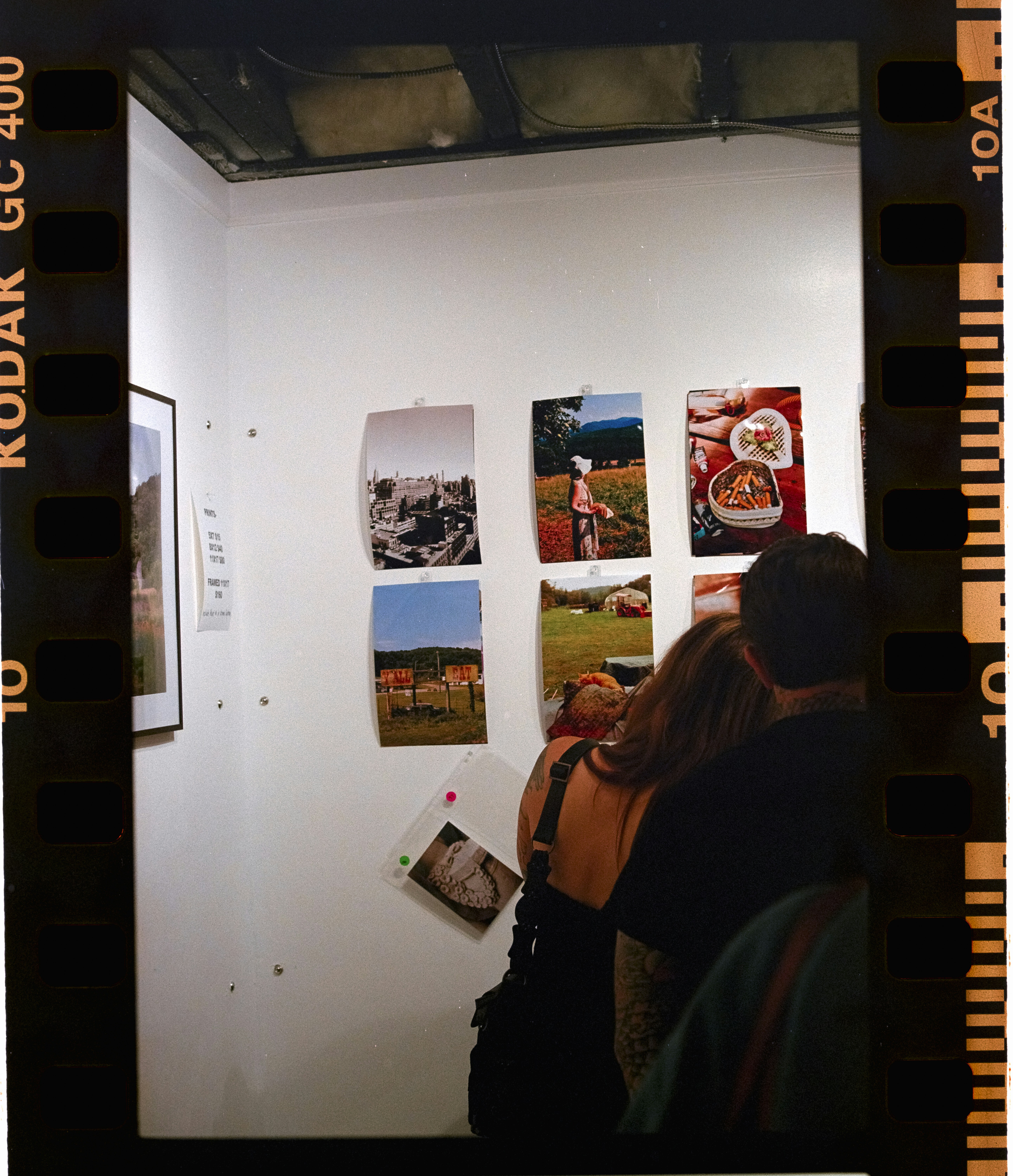 People viewing artwork on gallery wall
