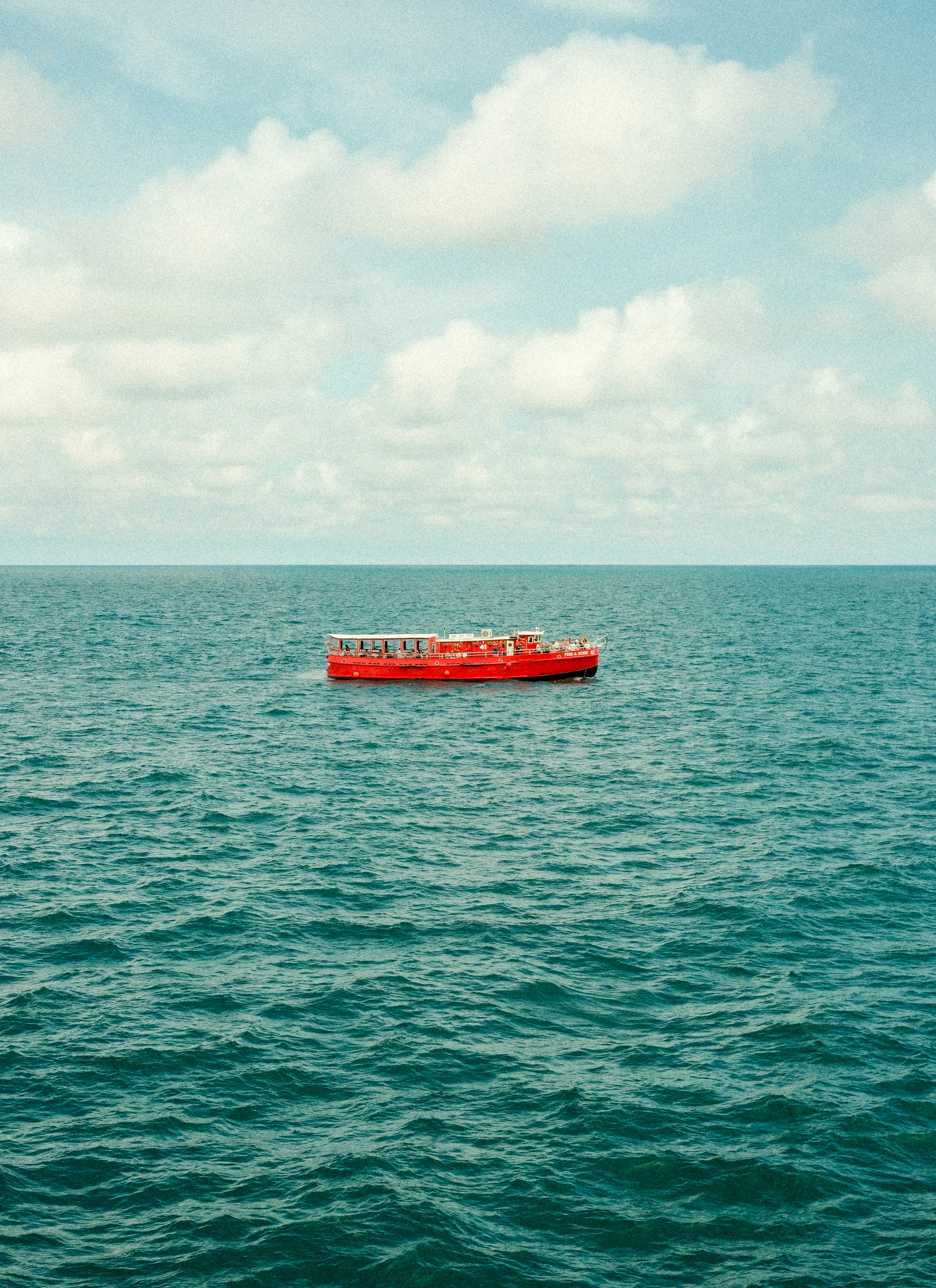 Crimson Voyager on Serene Waters