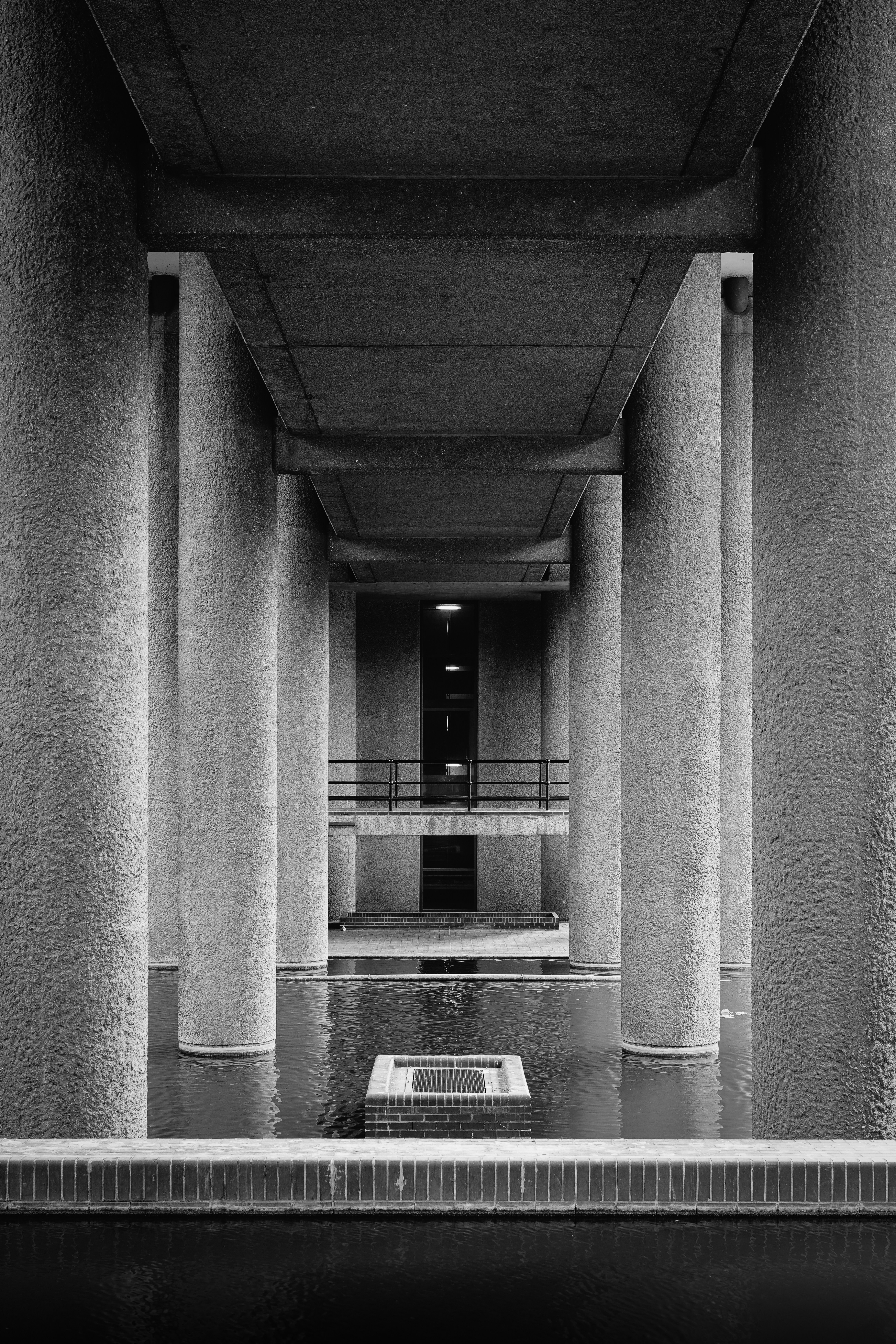 Concrete columns and water in brutalist architecture photo – Free ...
