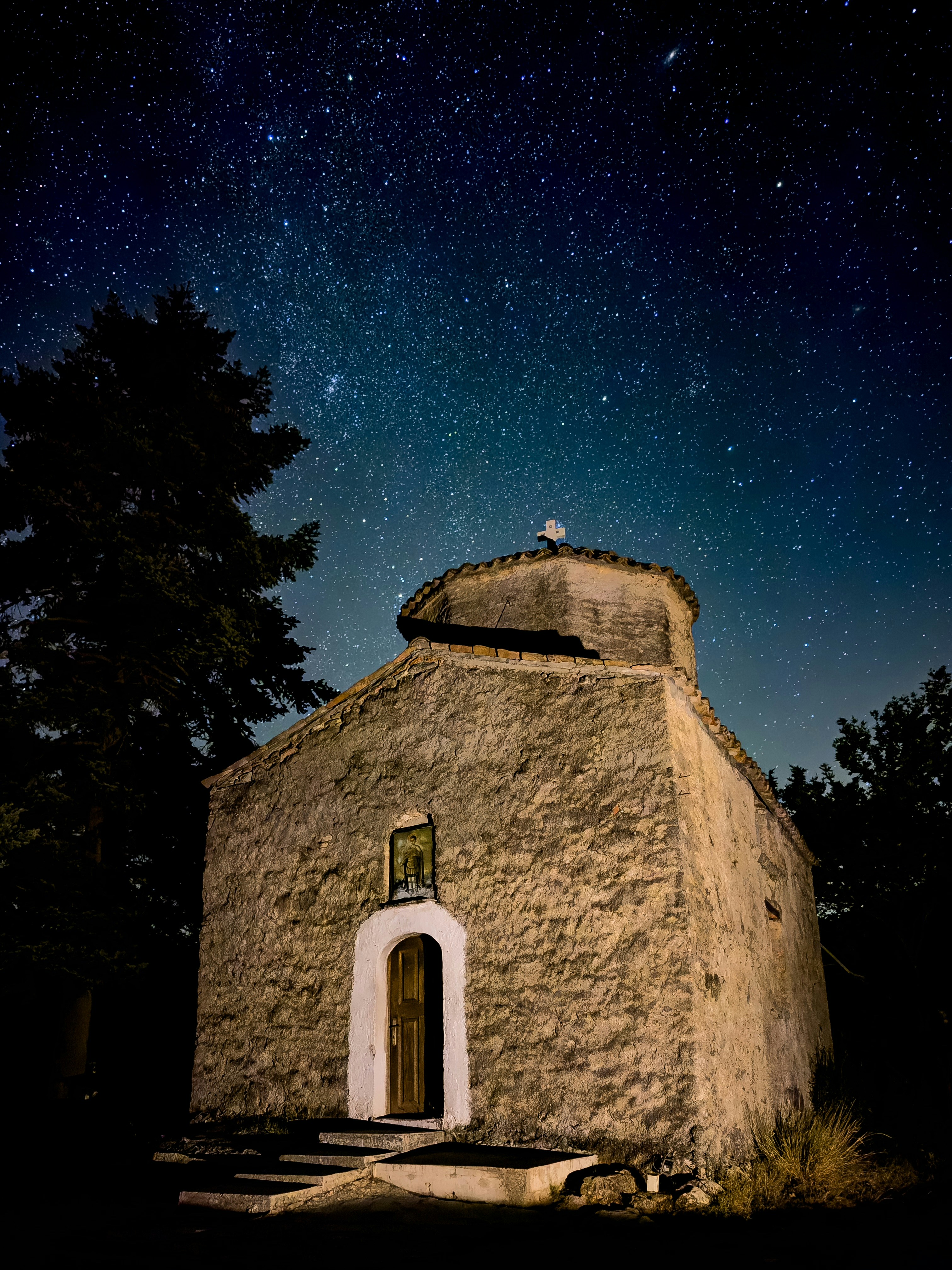 Shot on iPhone 16 Pro Max, edited on Lightroom Mobile | Stone church under a starry night sky