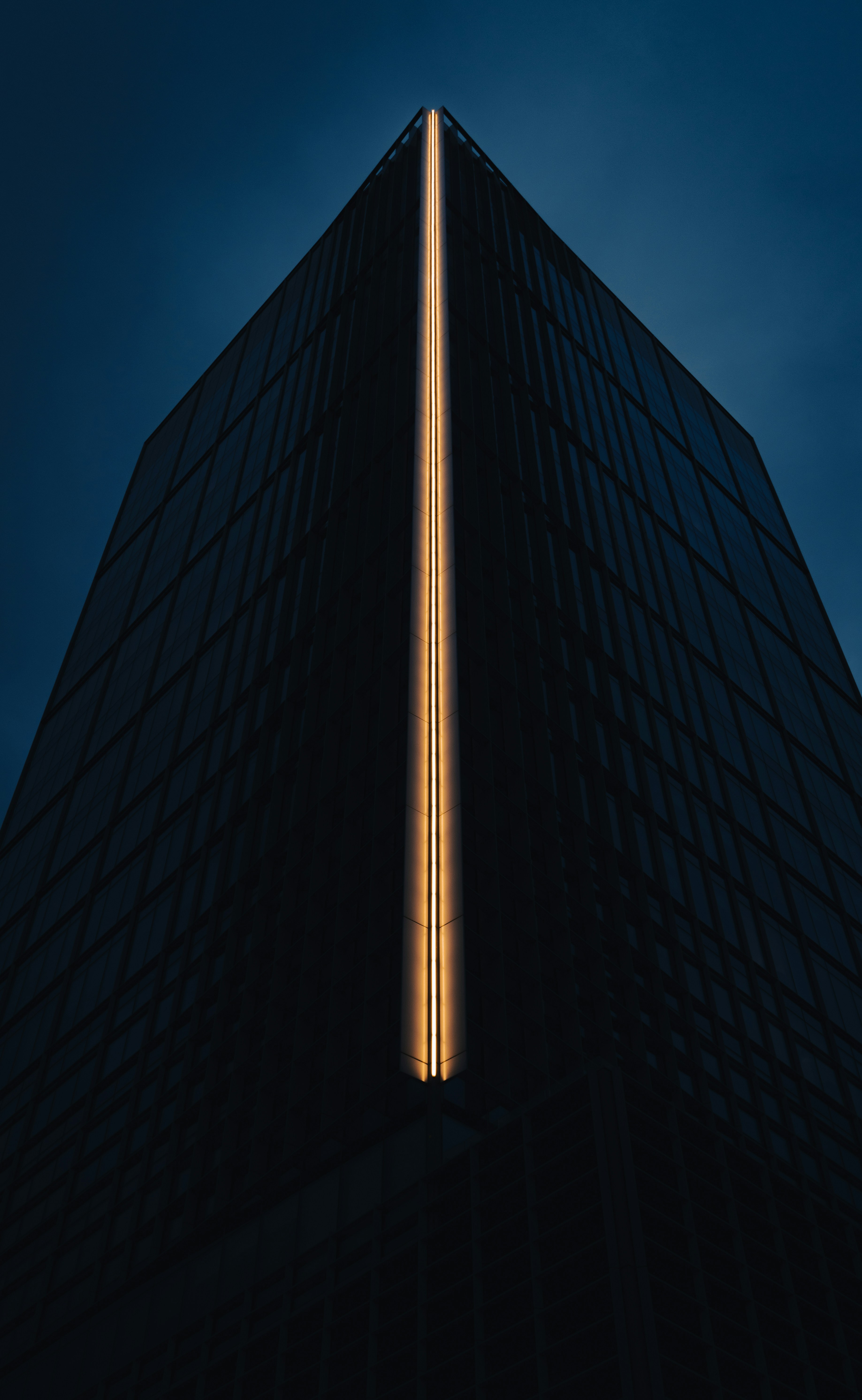 Modern skyscraper with a bright light strip