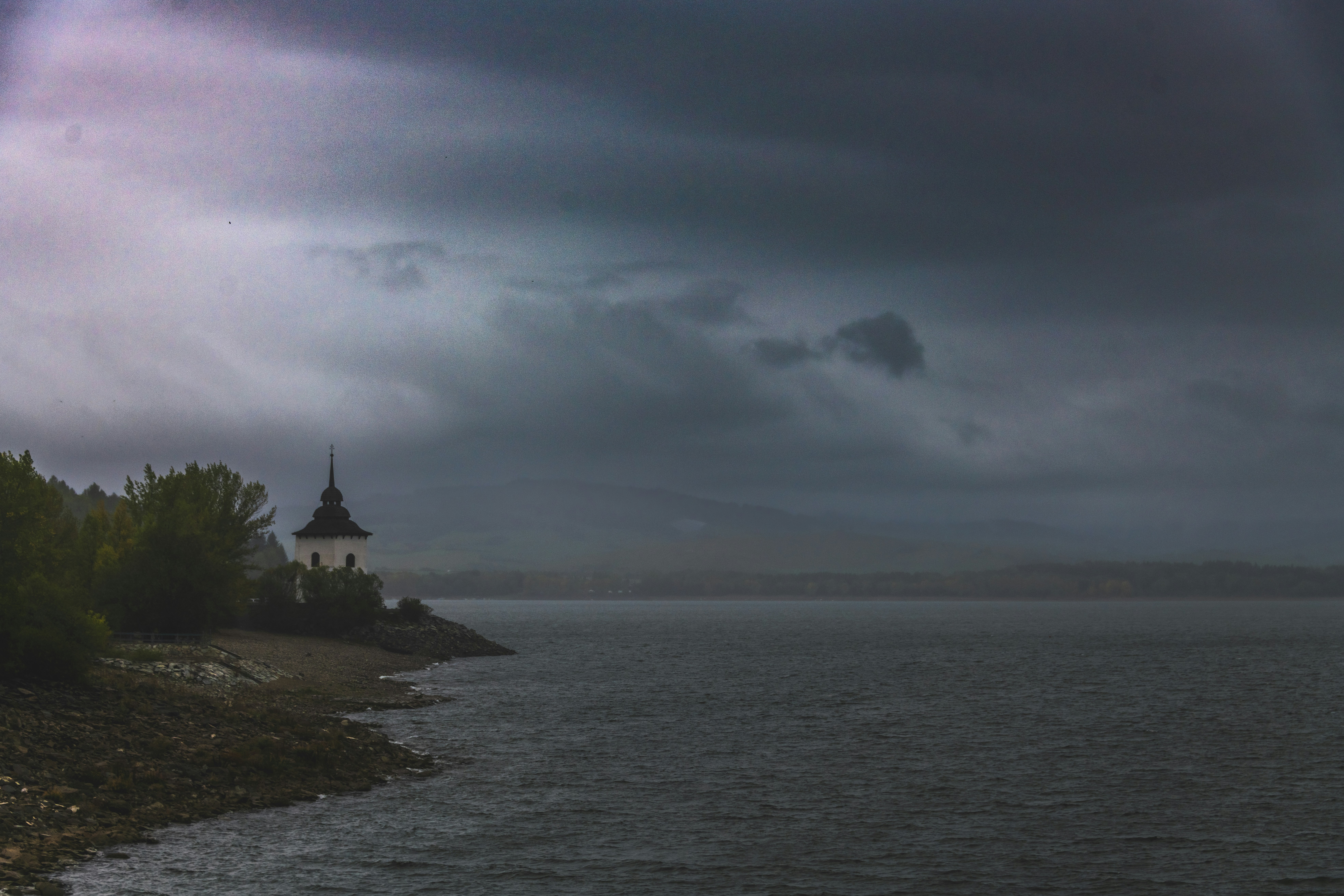 Whispers of the Waterside: A Lighthouse in the Mist