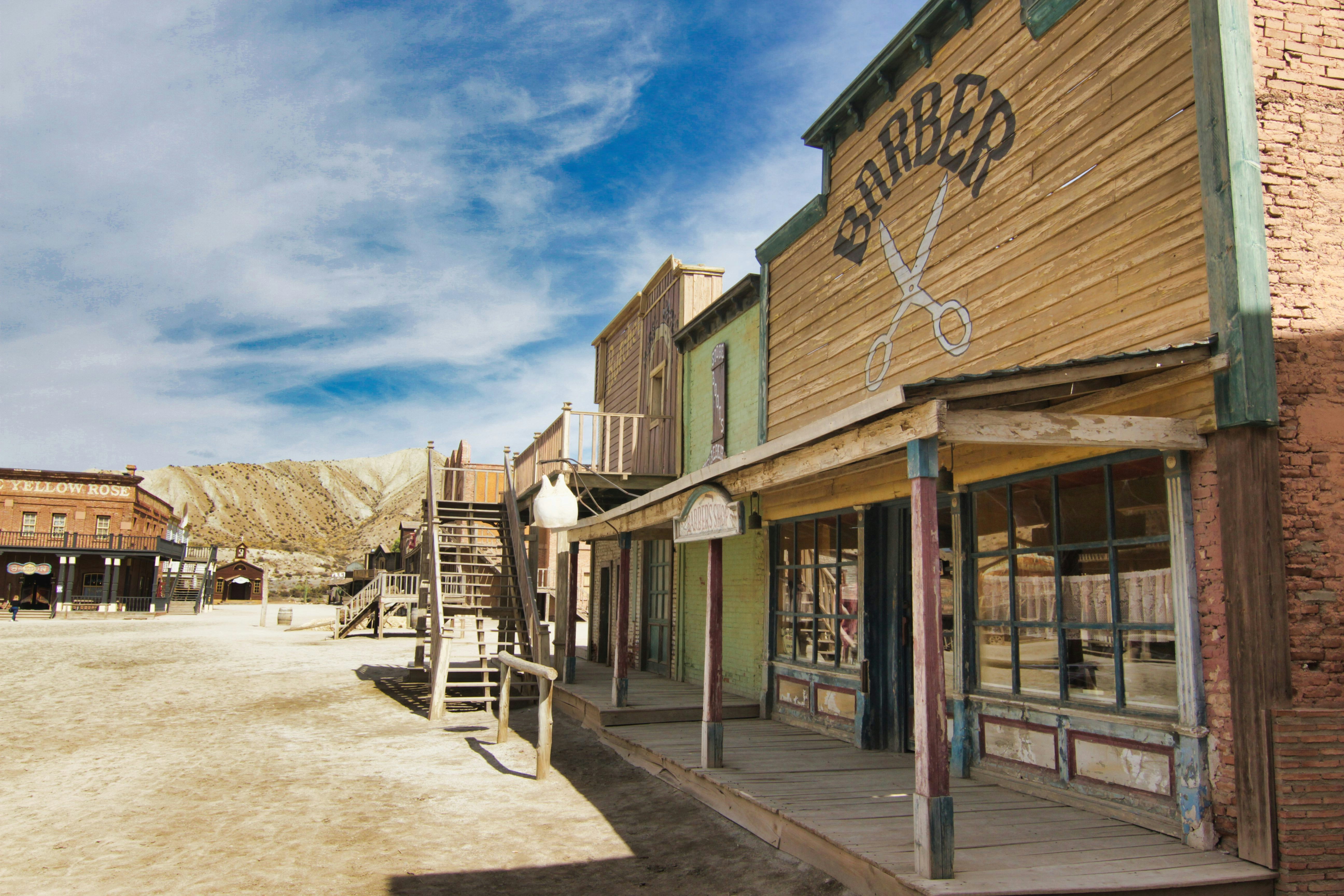 Old western town street with barber shop storefront. photo – Free ...