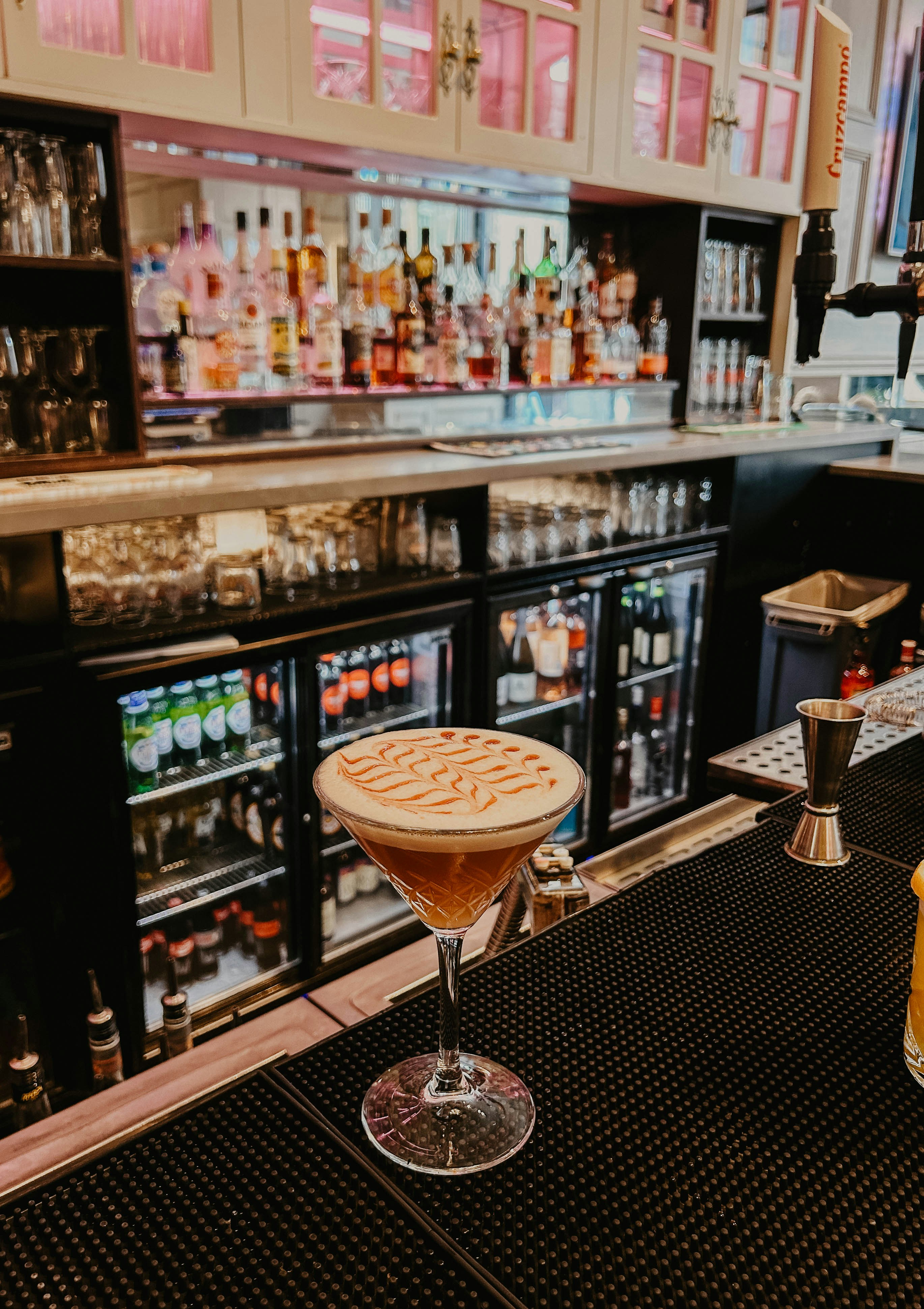 Tilted Martini at the Bar: a Creamy Foam Spotlight