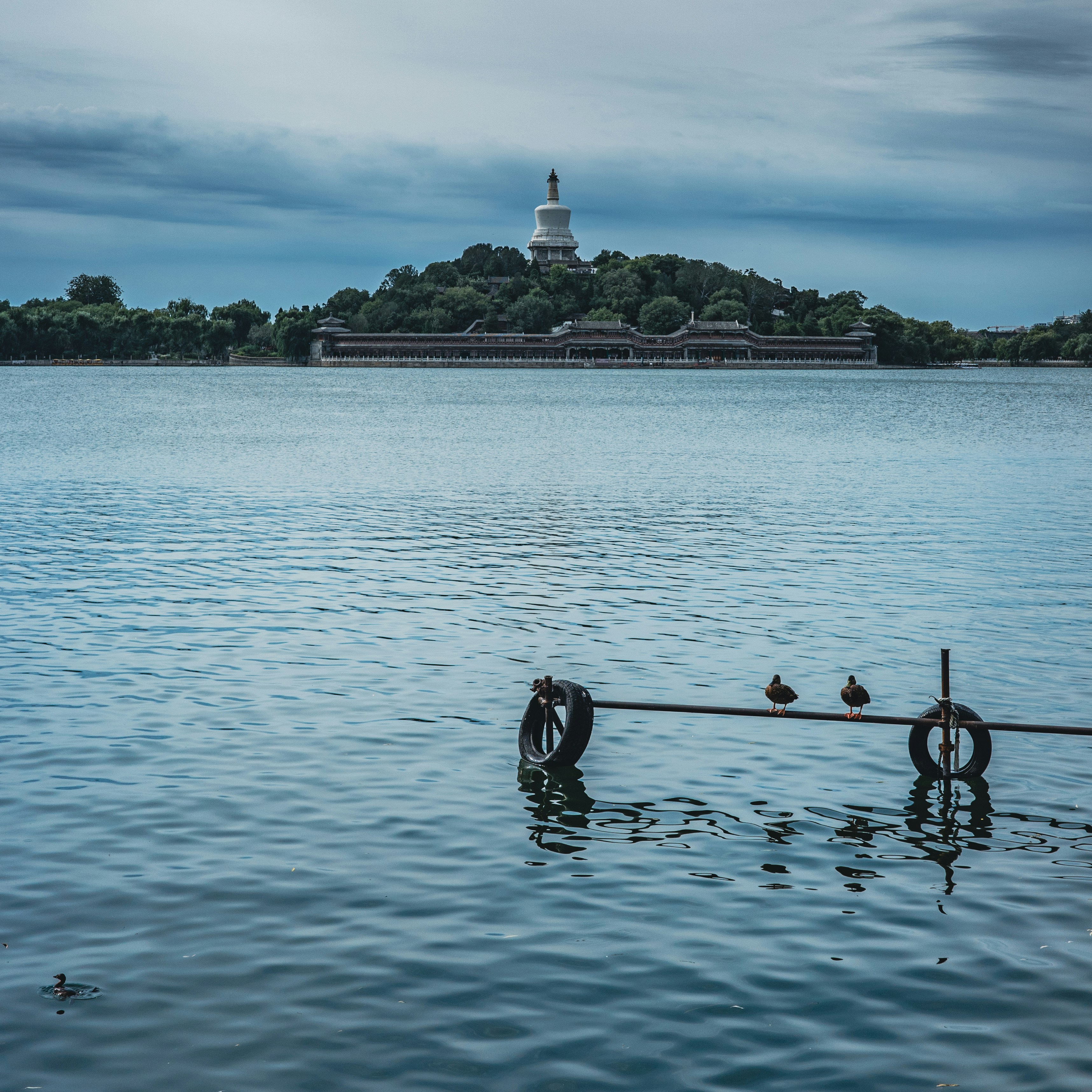 Isle Lantern: A White Pagoda Rising Over Quiet Blue Waters