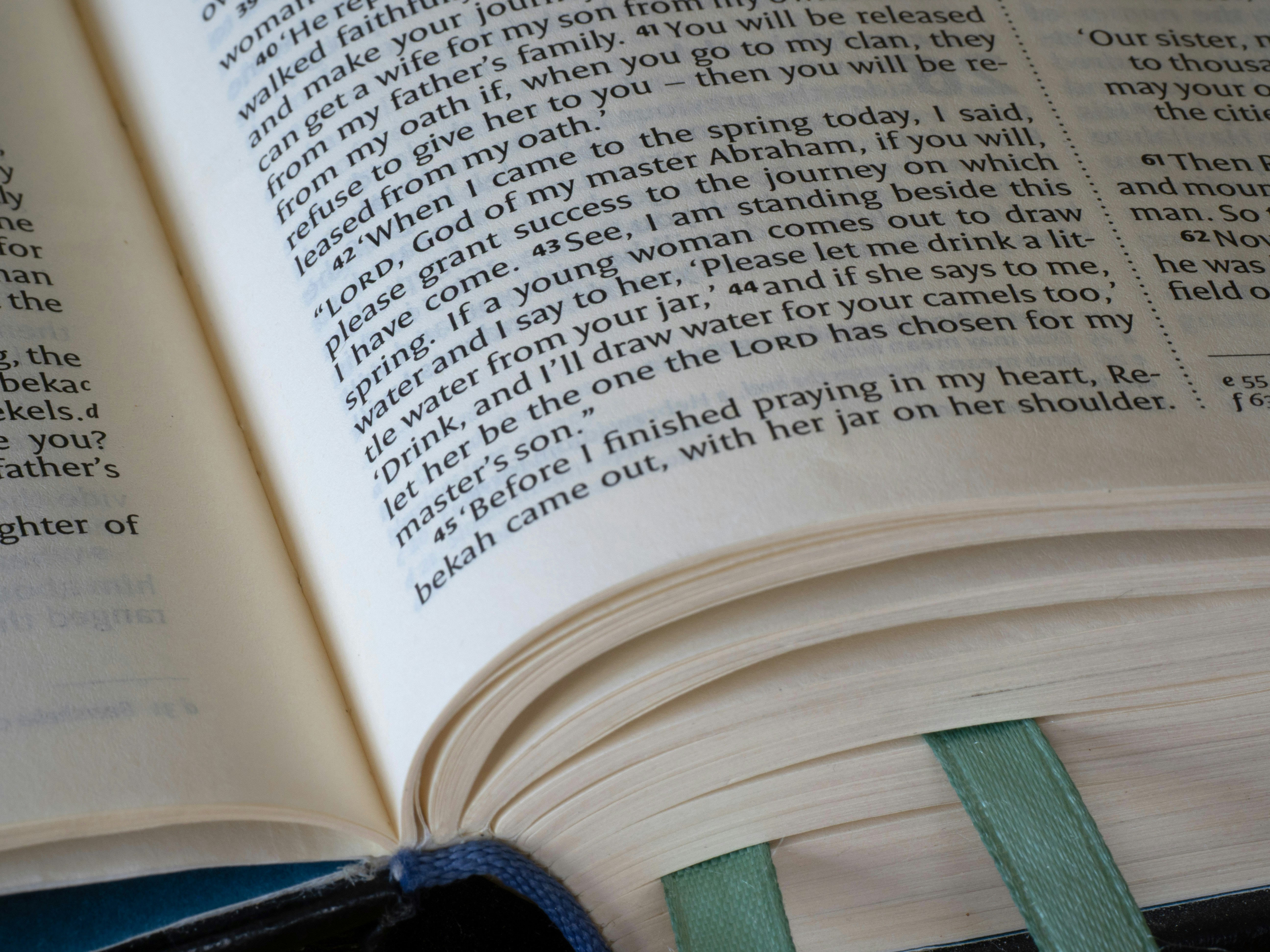 Open Bible revealing a passage about divine guidance and prayer, with a focus on the text and margins. The scene captures a moment of reflection.