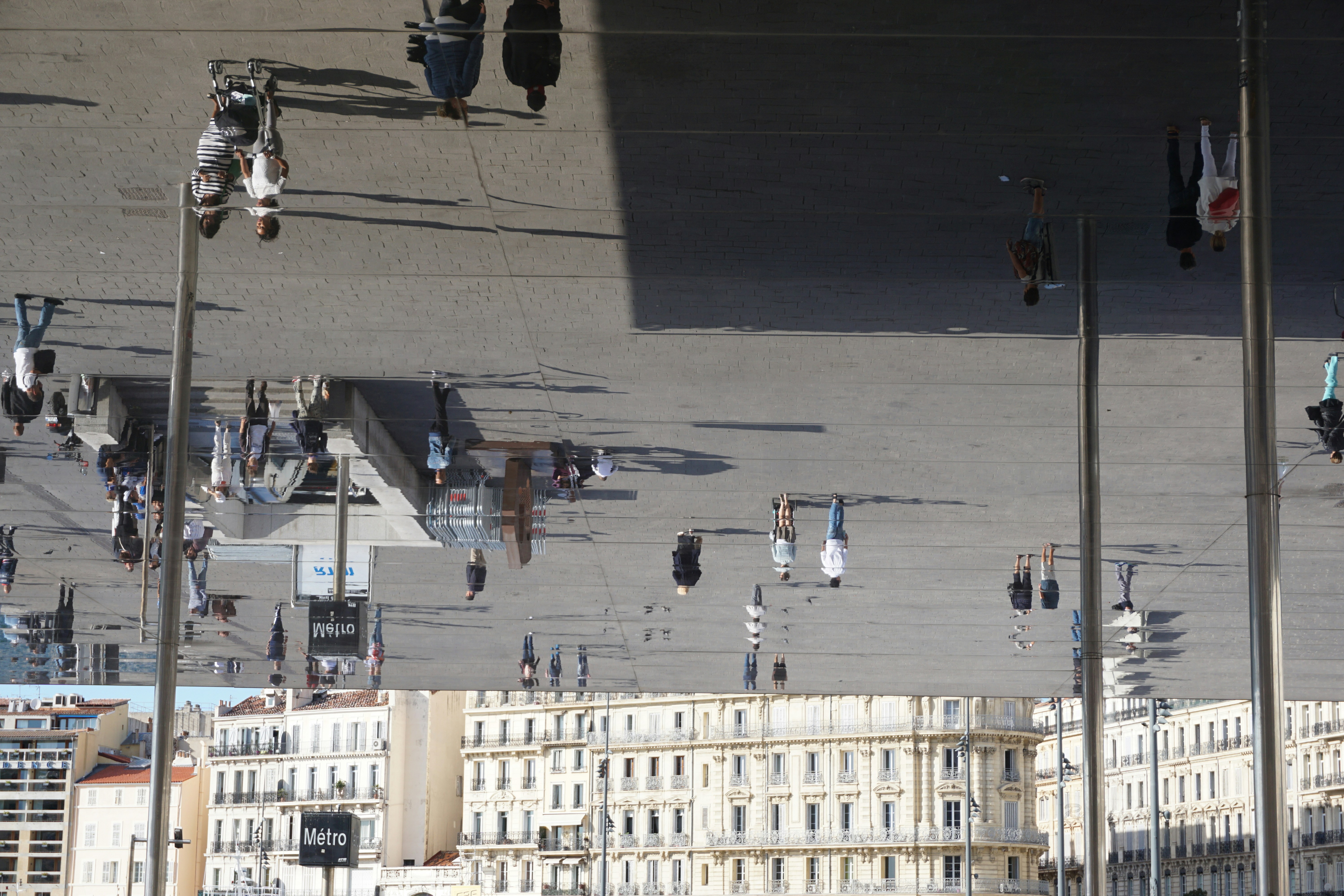 Reflections of Urban Life: A Dance of Shadows