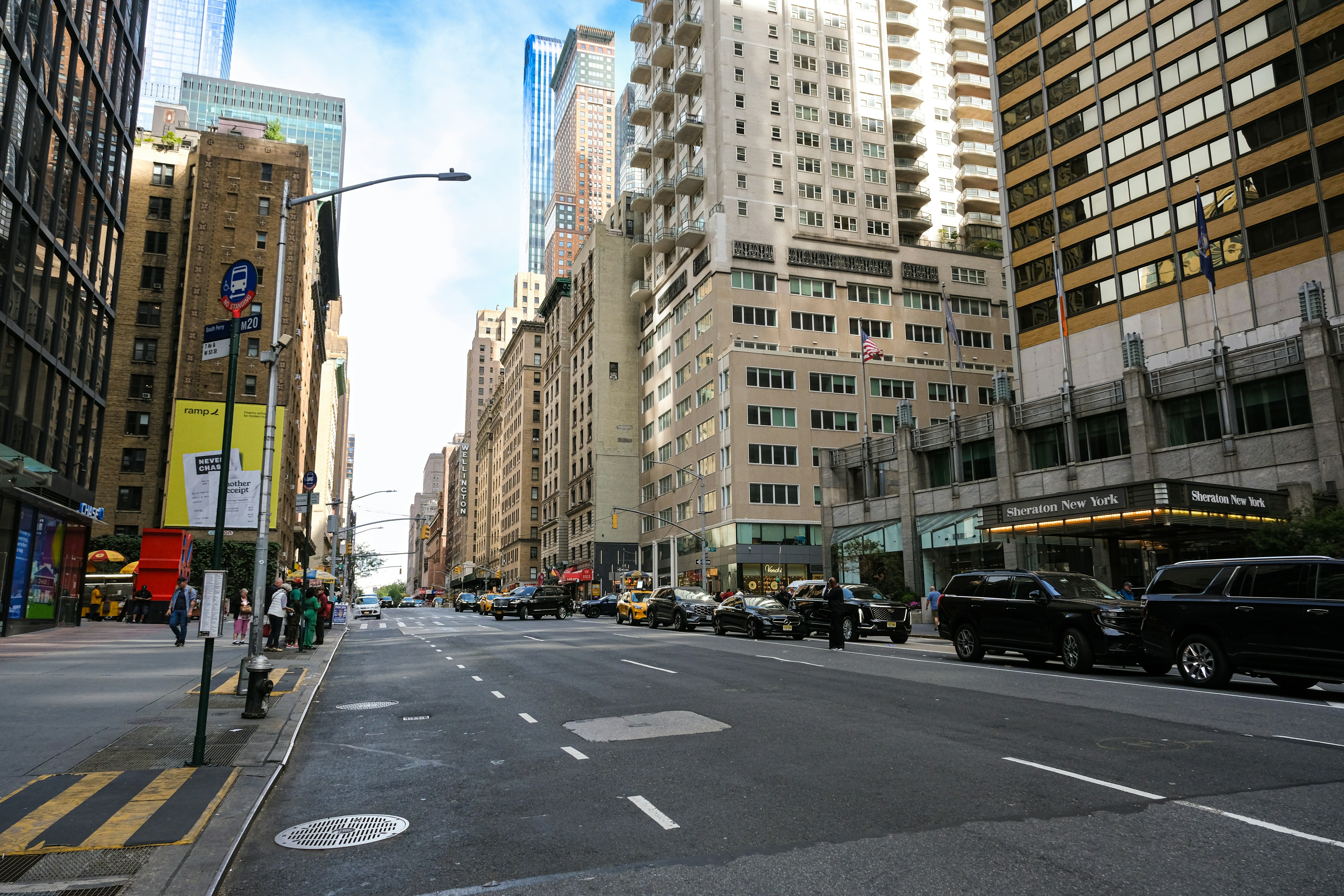 City street with tall buildings and cars