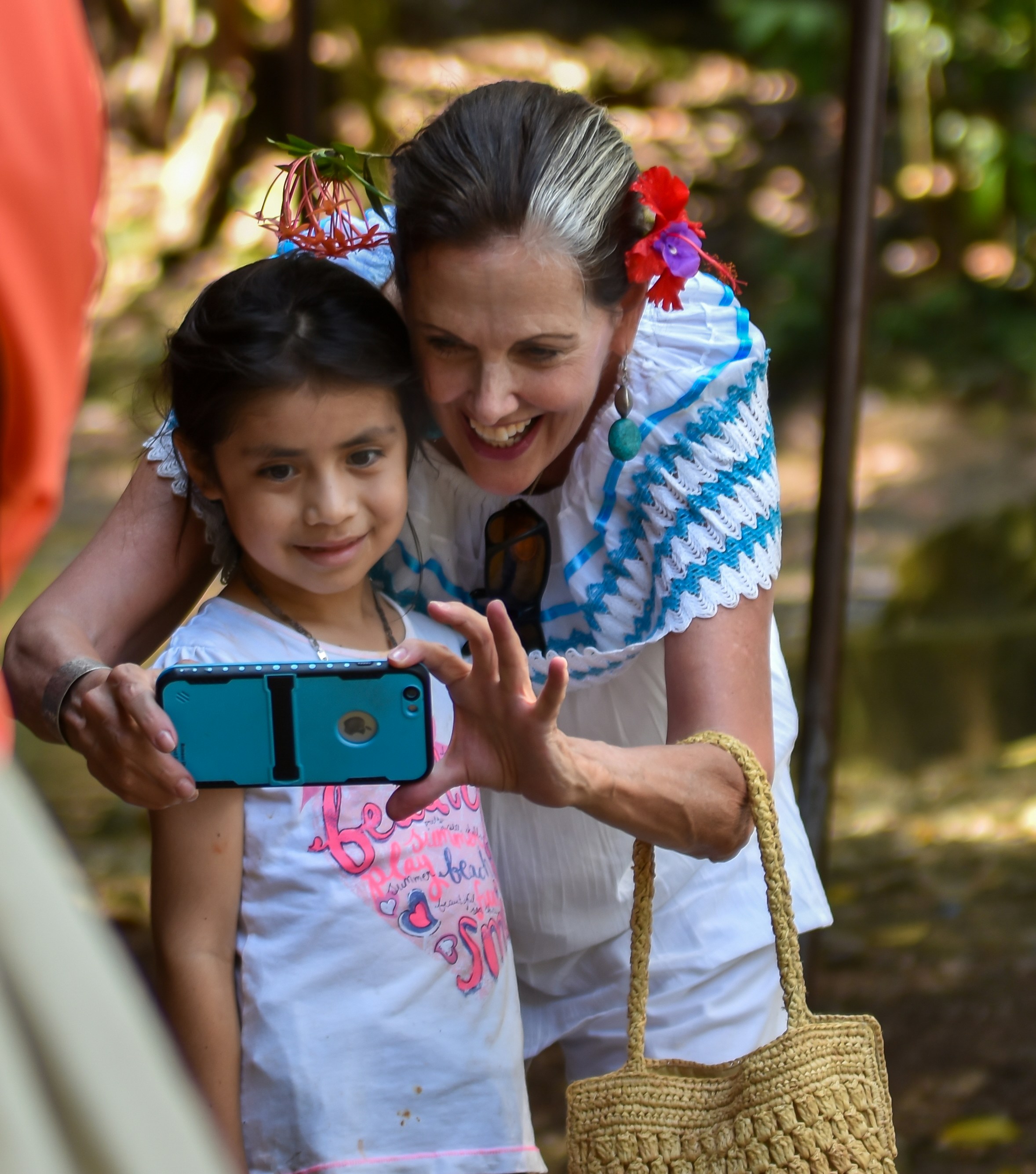 Guatemala Sightseeing | Woman and child taking a selfie with phone