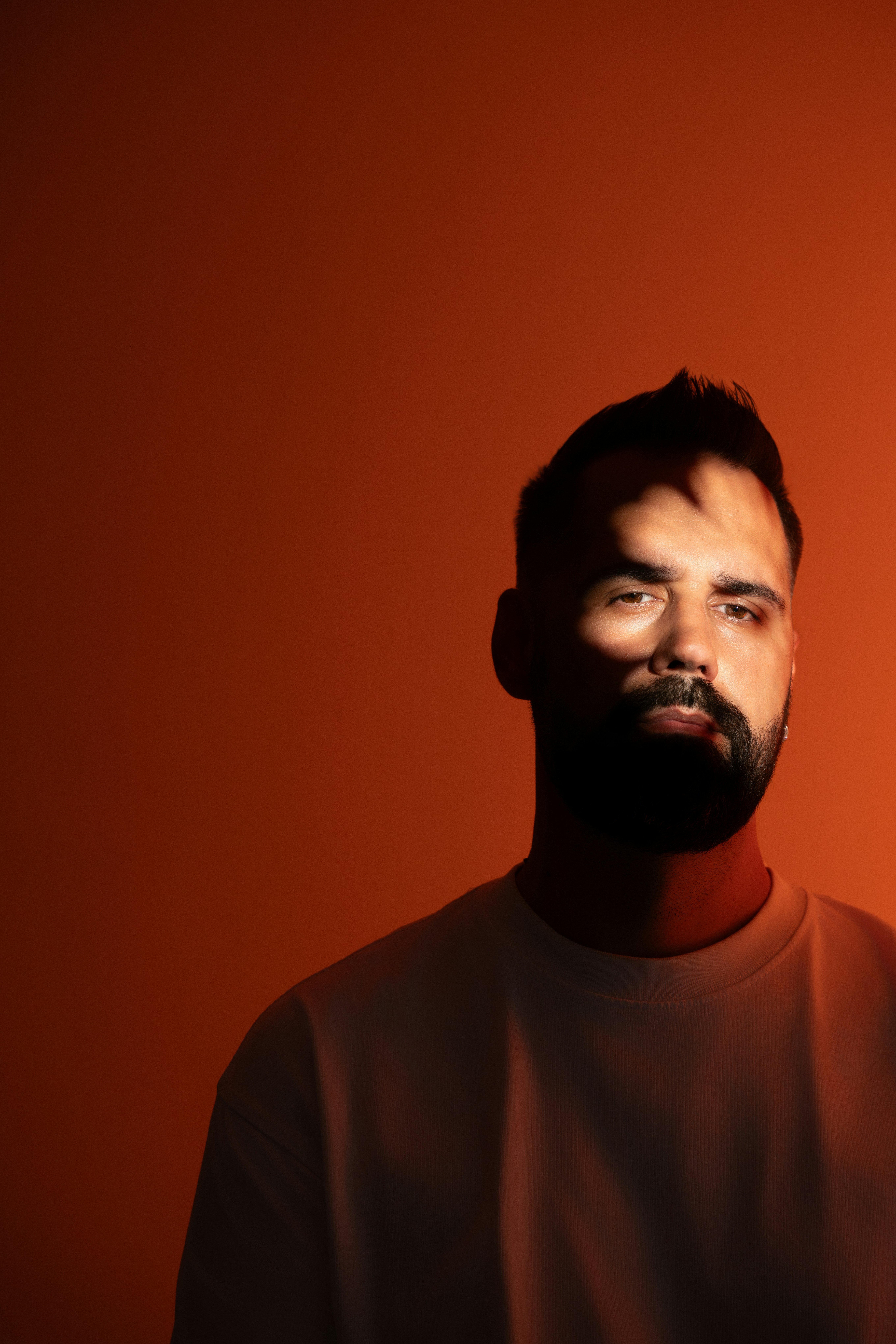 Man with beard and shadows on face