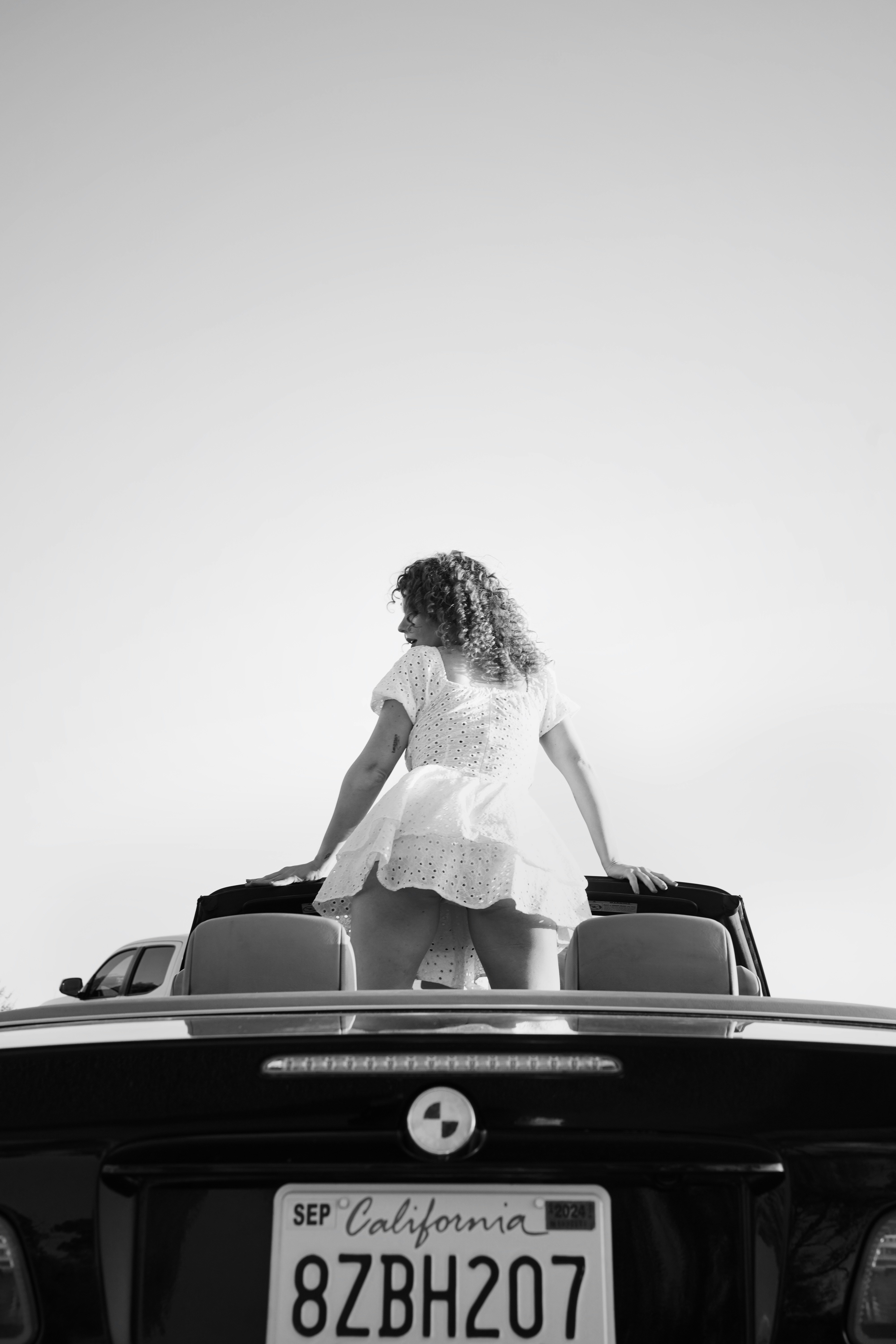 Summer Drift | Woman in white dress on convertible car trunk