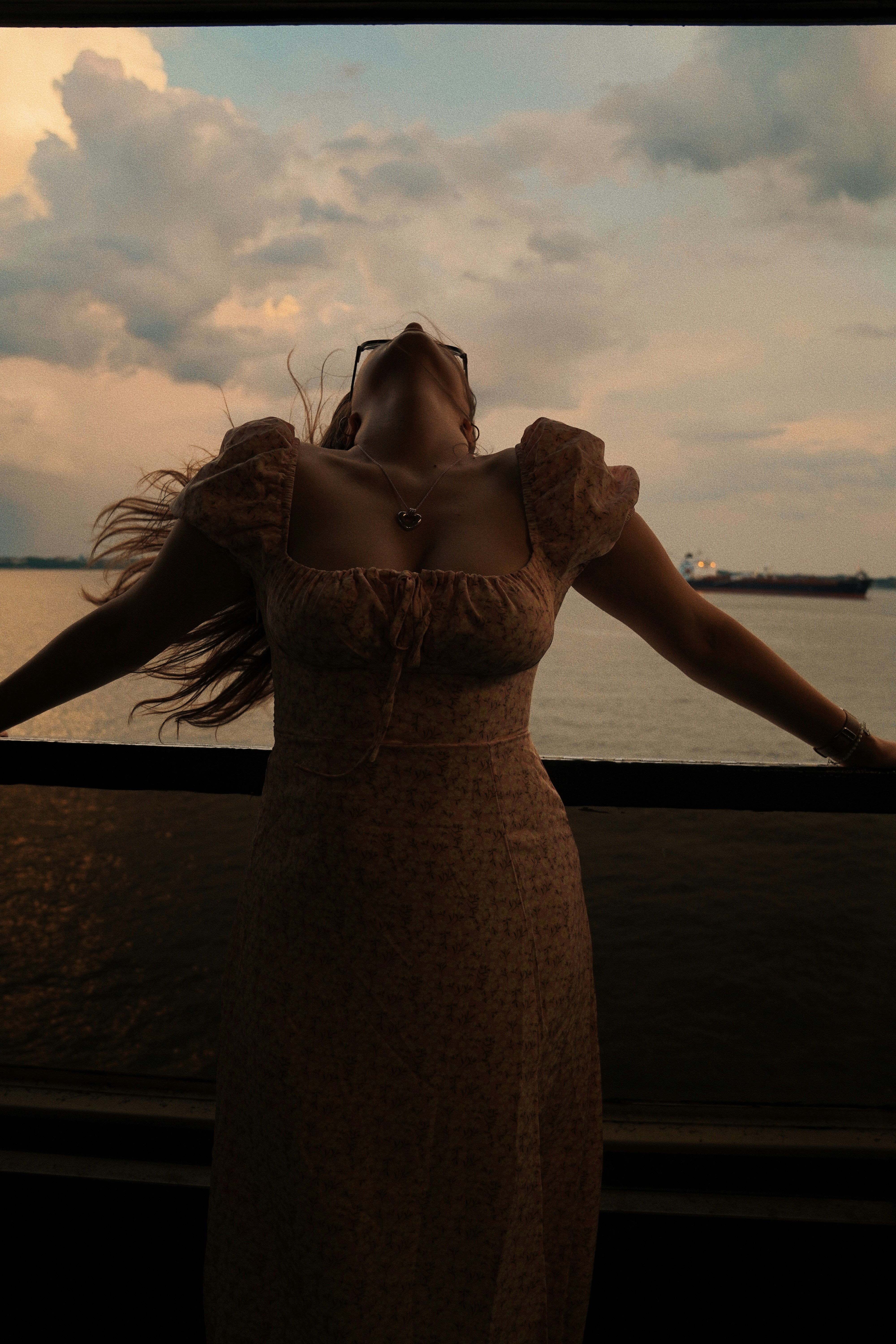 Silhouette by the Waterfront: Lace Dress at Dusk