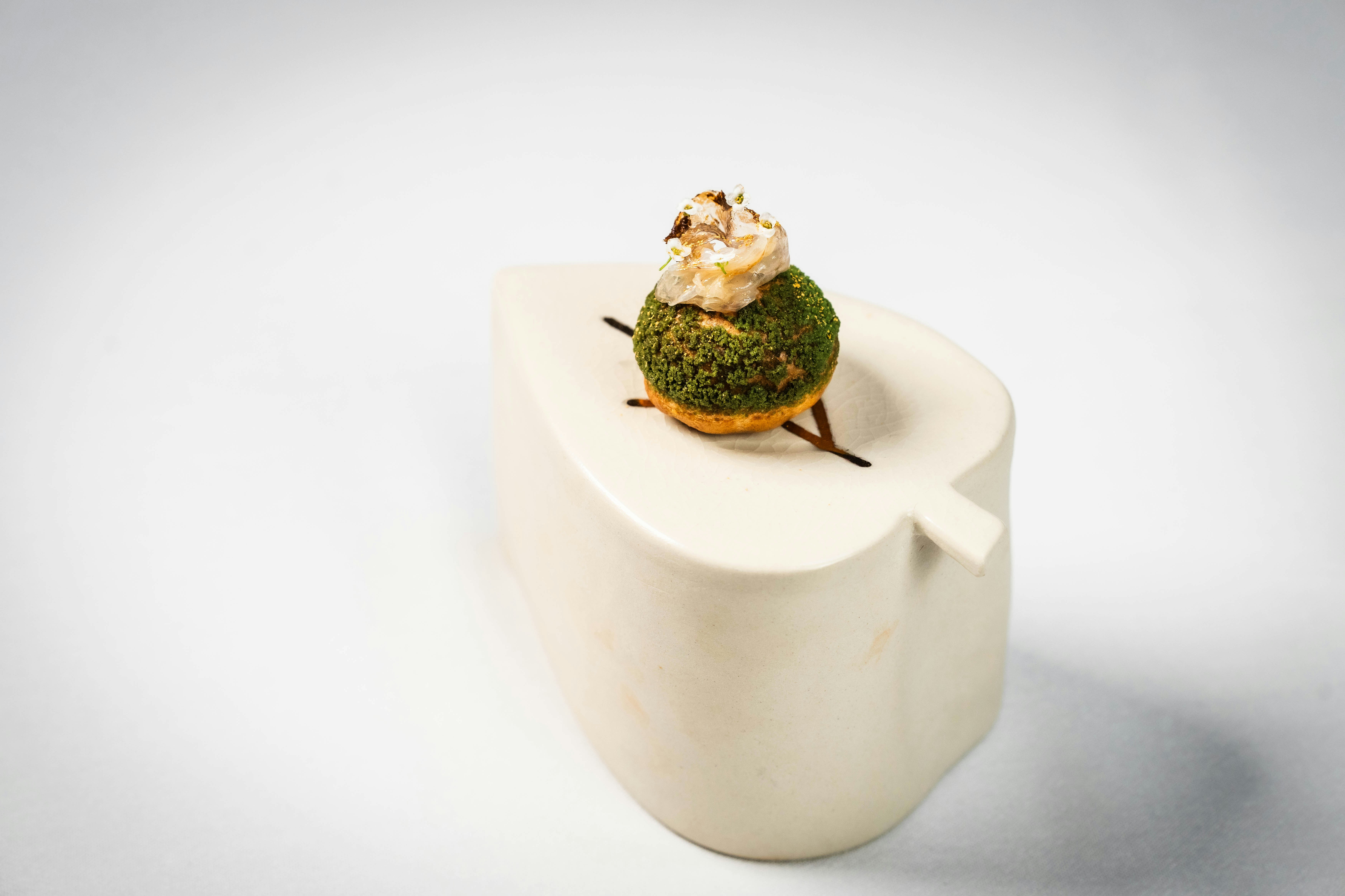 Verdant Truffle on a Porcelain Crest
