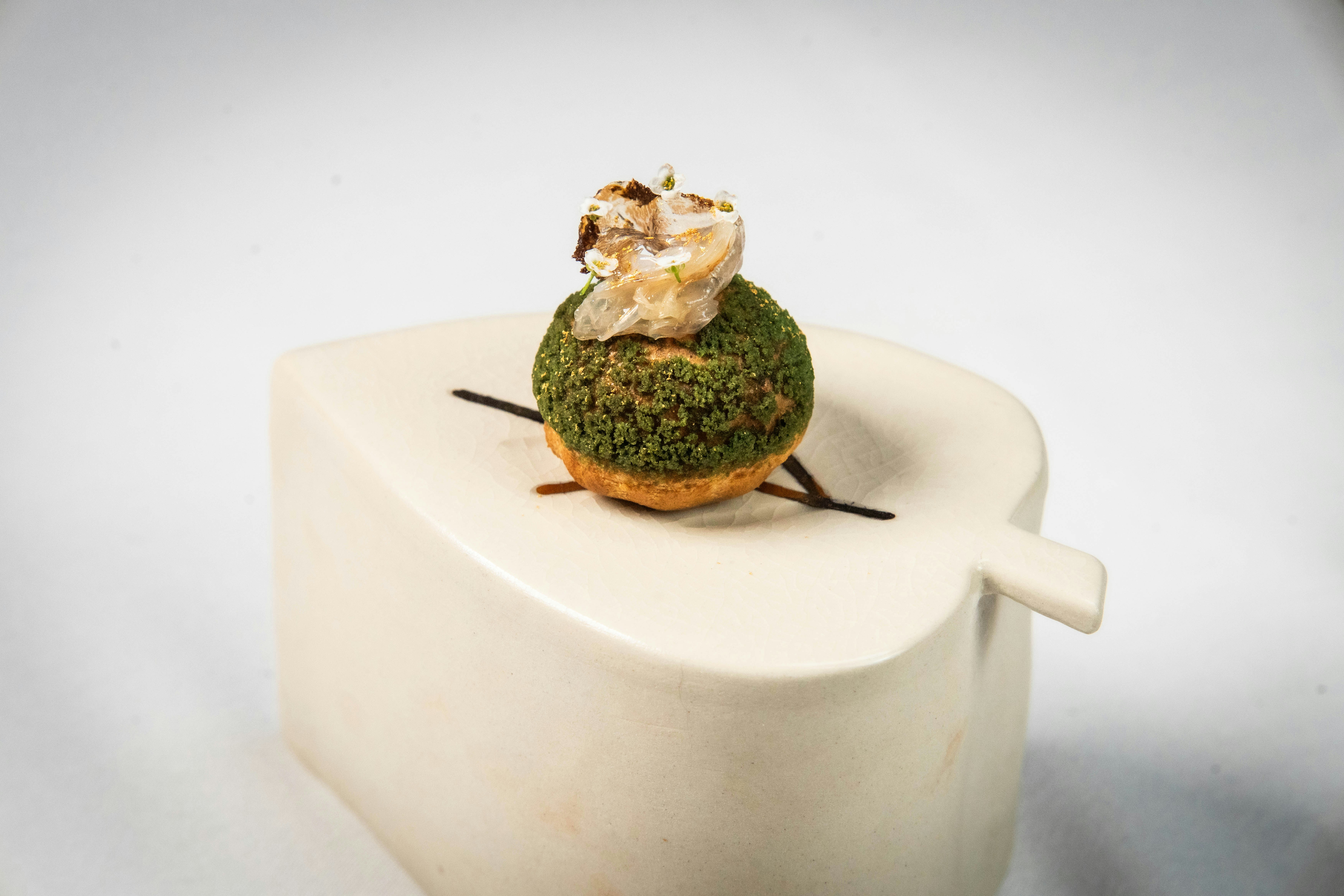 Verdant Orb on a Ceramic Crest: A Studio Dessert Portrait