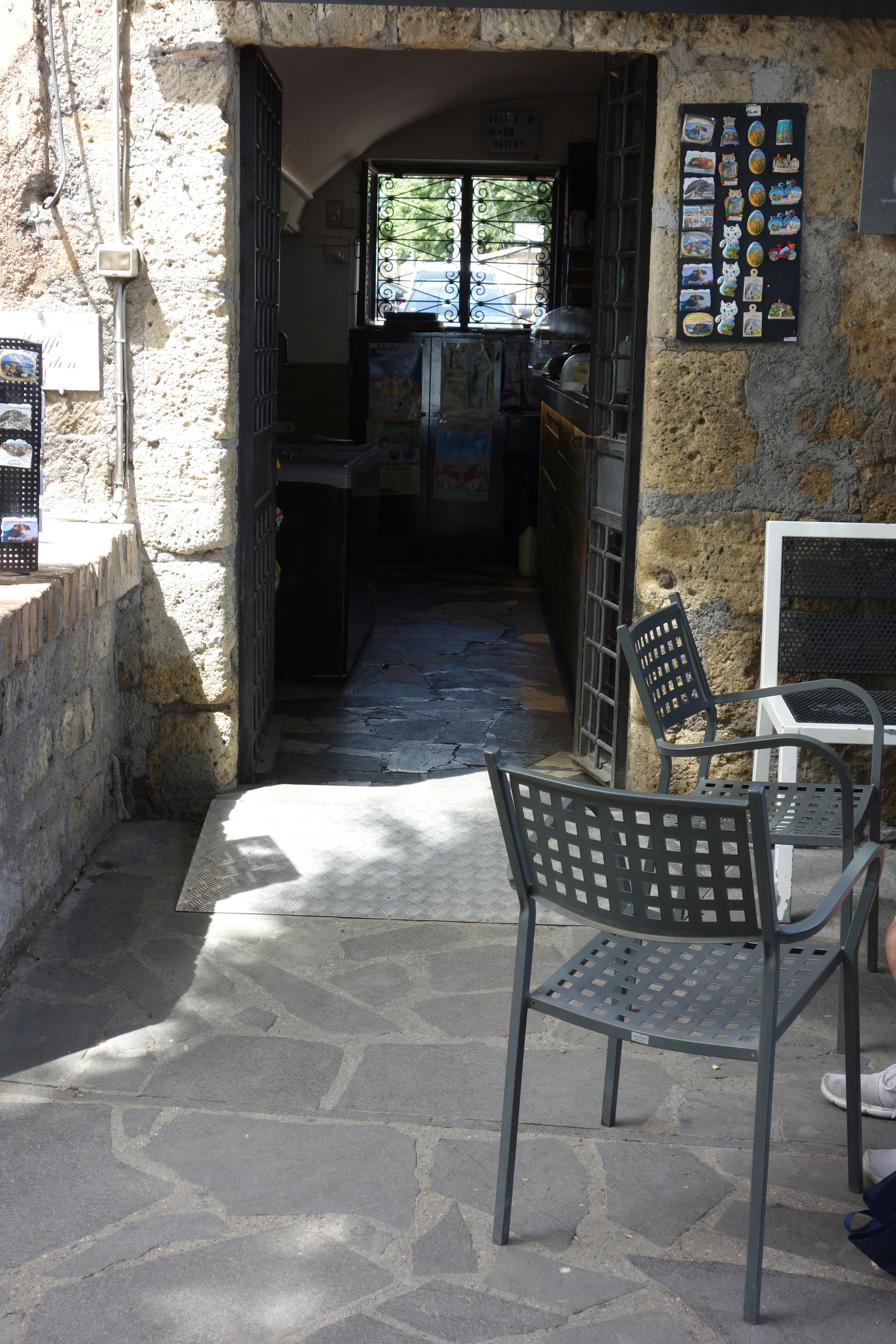 Threshold of Light: Sunlit Stone Courtyard Café