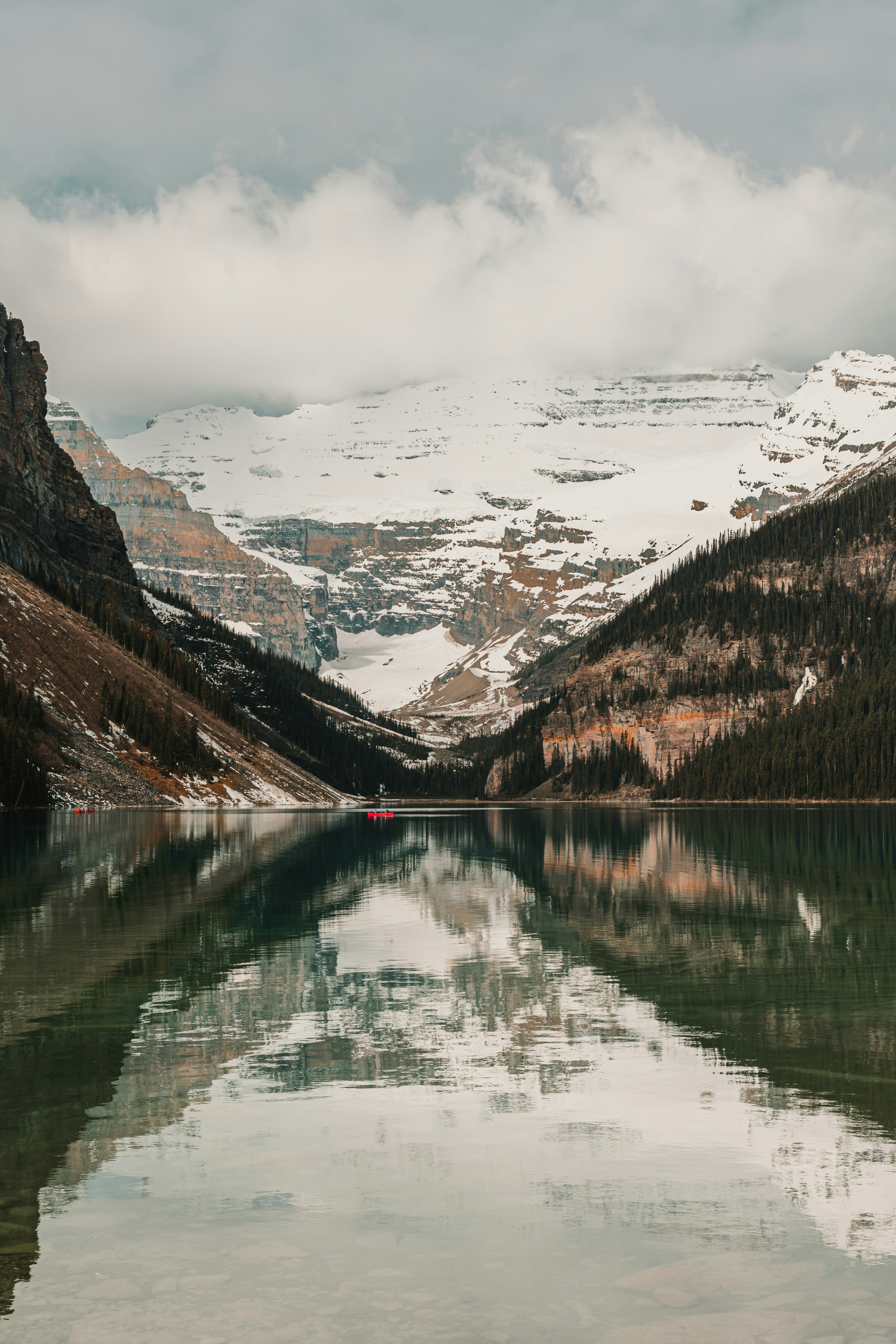 Snowy mountains reflected in a calm lake