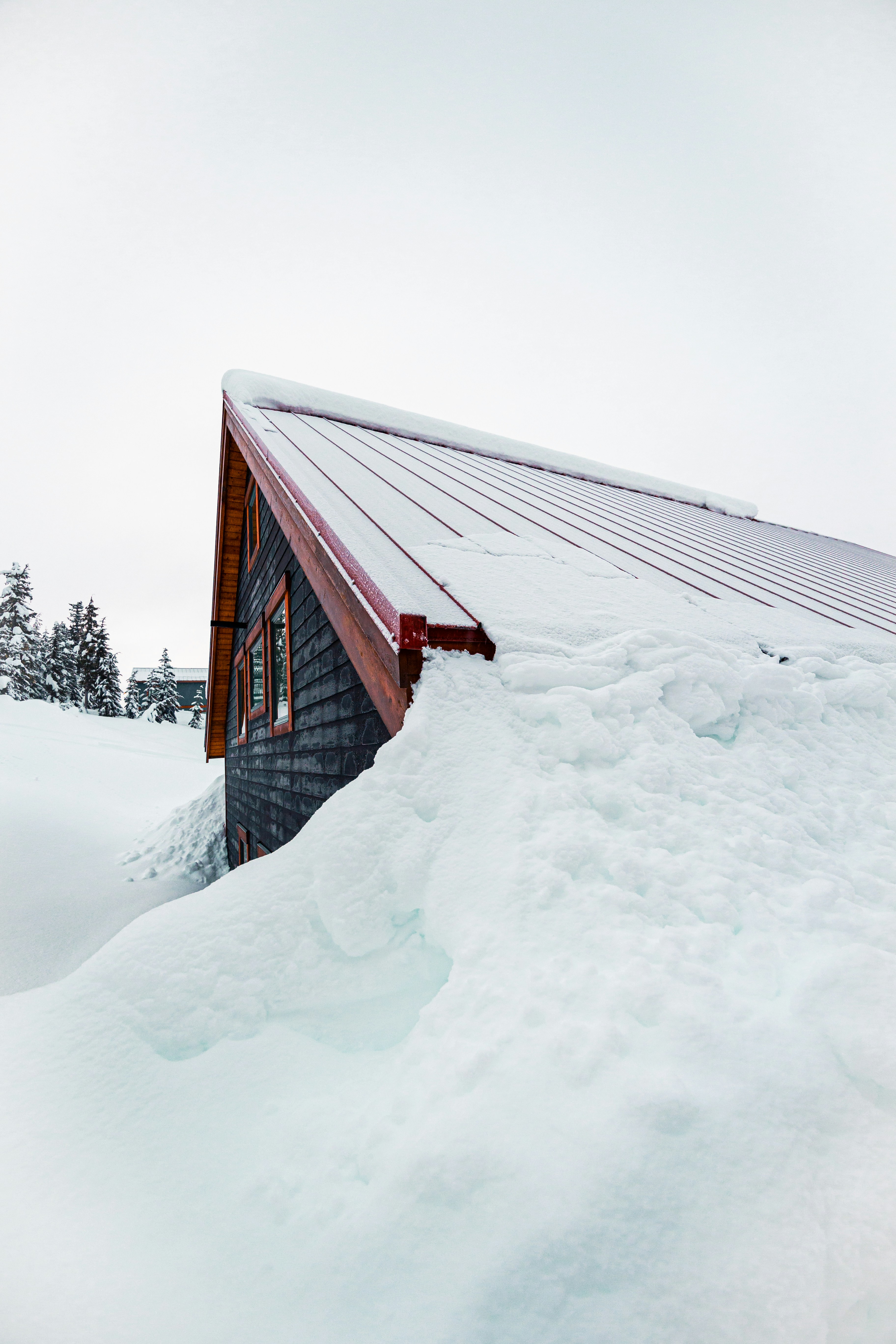 A cabin covered in deep snow during winter photo – Free Building Image ...