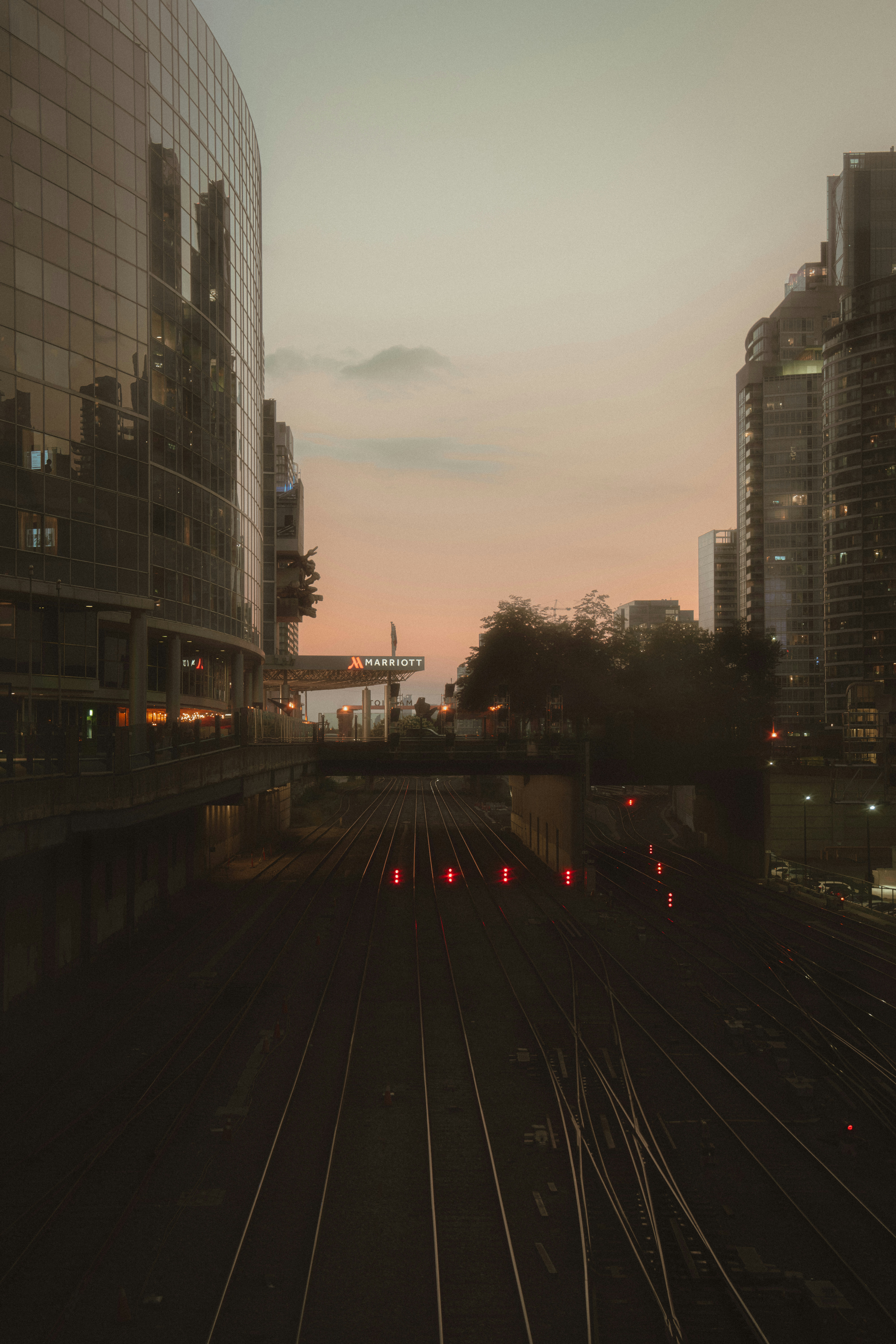Convergence at Sunset: Rails and Skyscrapers Align